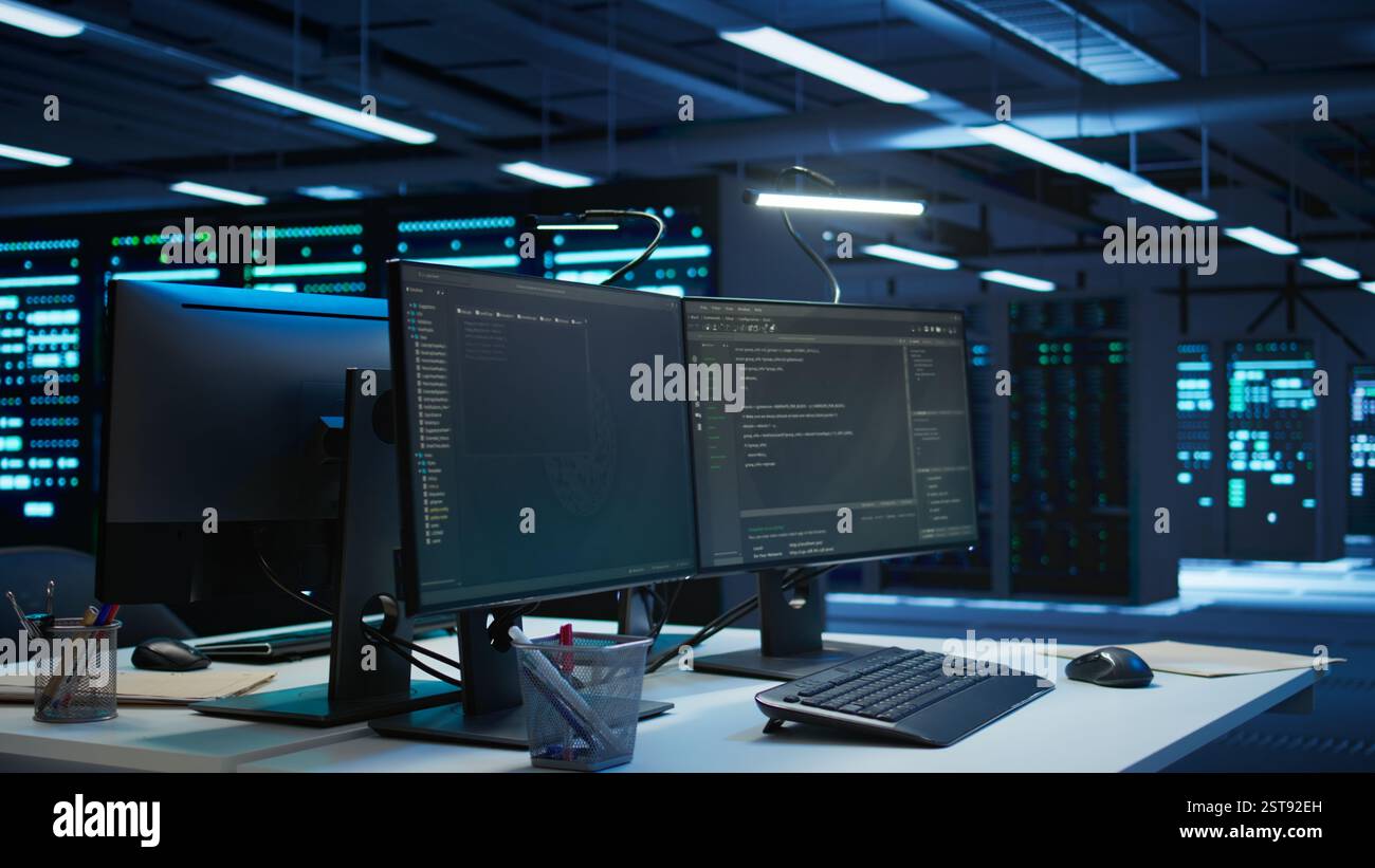 Multi monitor computer setup in data center used for monitoring ...