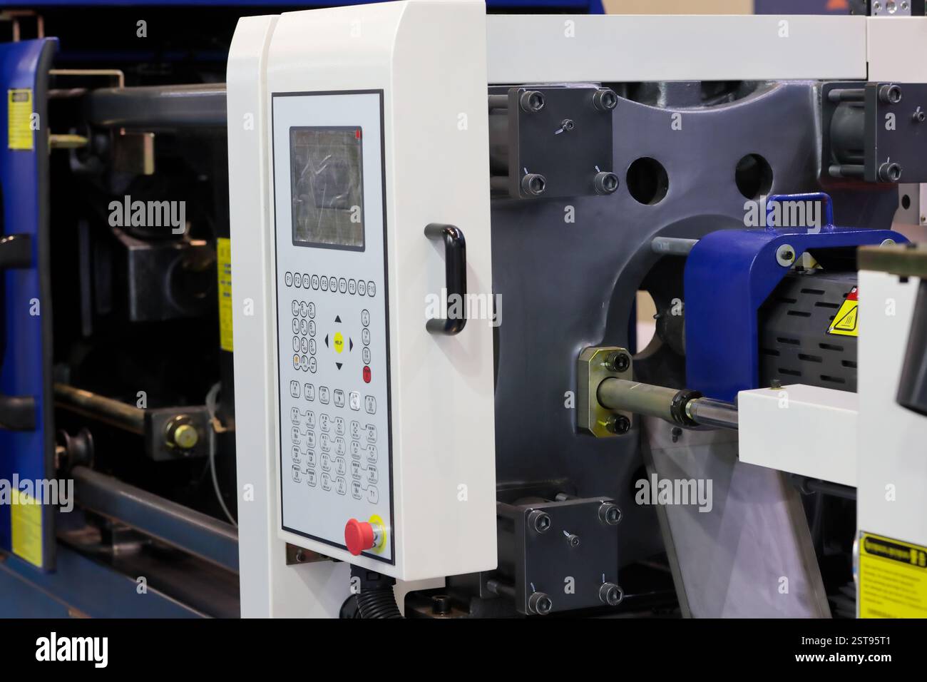 Closeup of plastic injection molding press machine. Selective focus ...