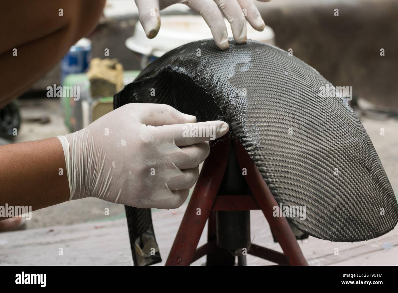Wrapping carbon fiber or kevlar and man hand for working Stock Photo ...