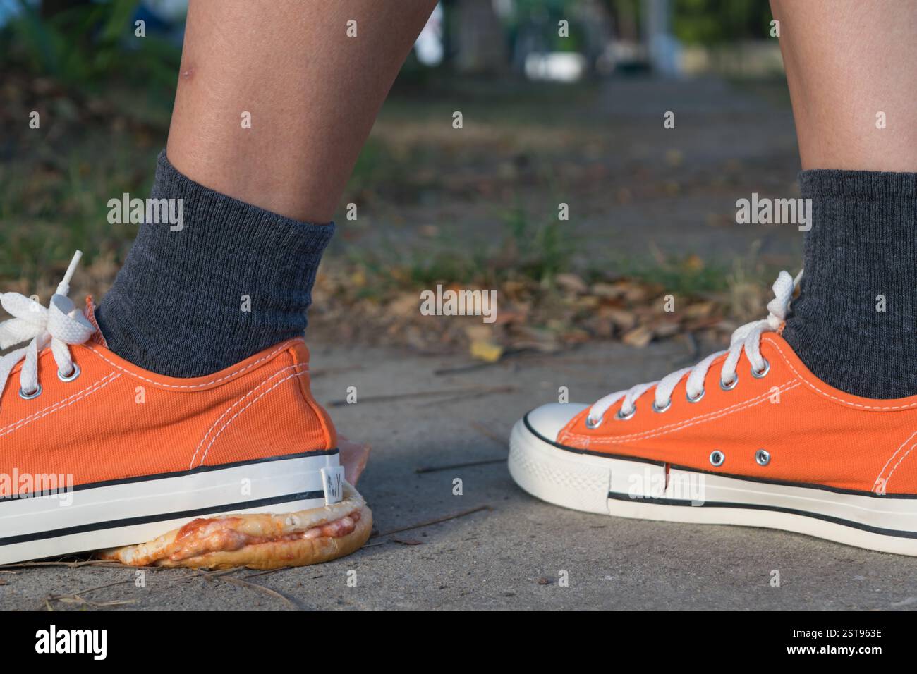 Good bye junk food hamburger left to jogging exercise Stock Photo - Alamy