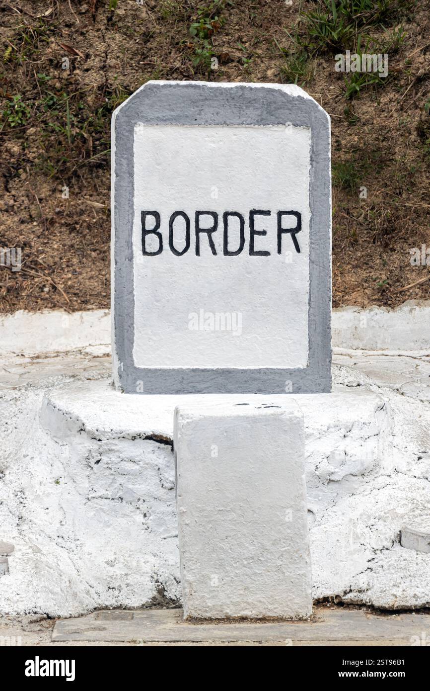Stone milestone at the border Stock Photo - Alamy
