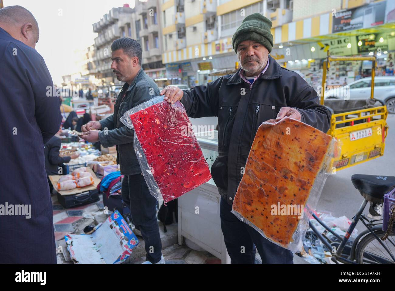 An Iranian street vendor waits for customers in the main market to sell ...