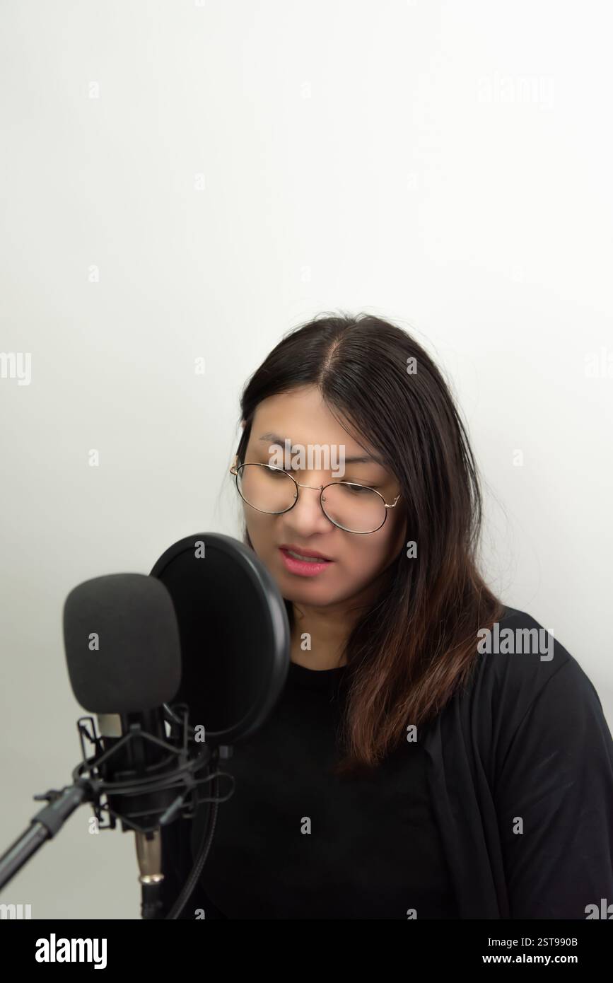 Beautiful asian woman (LGBTQ) is a singer. She enjoying sing a song or ...