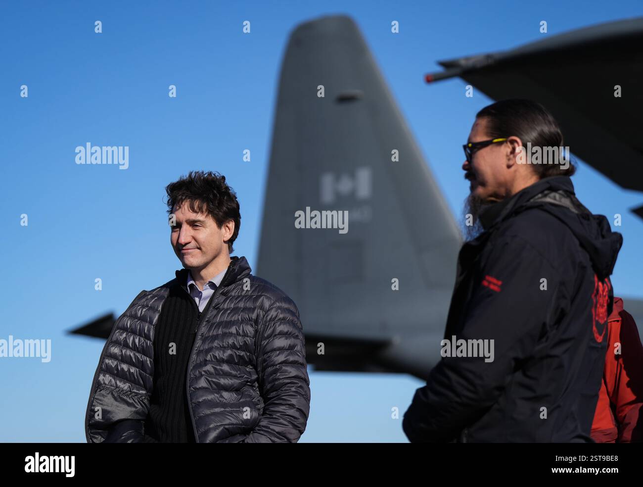 Prime Minister Justin Trudeau listens while being welcomed to Haida ...