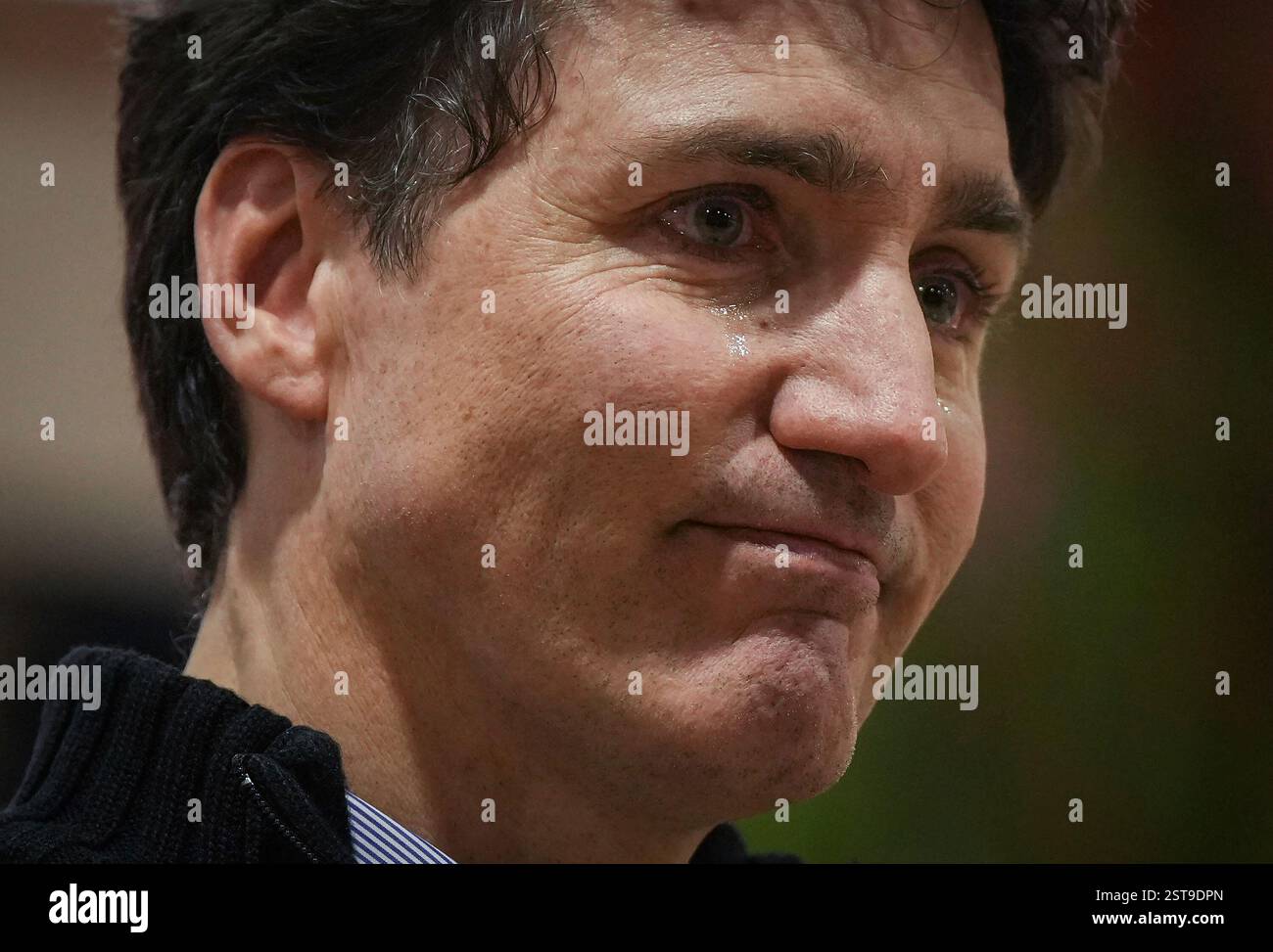 Tears run down Canada's Prime Minister Justin Trudeau's face as he ...