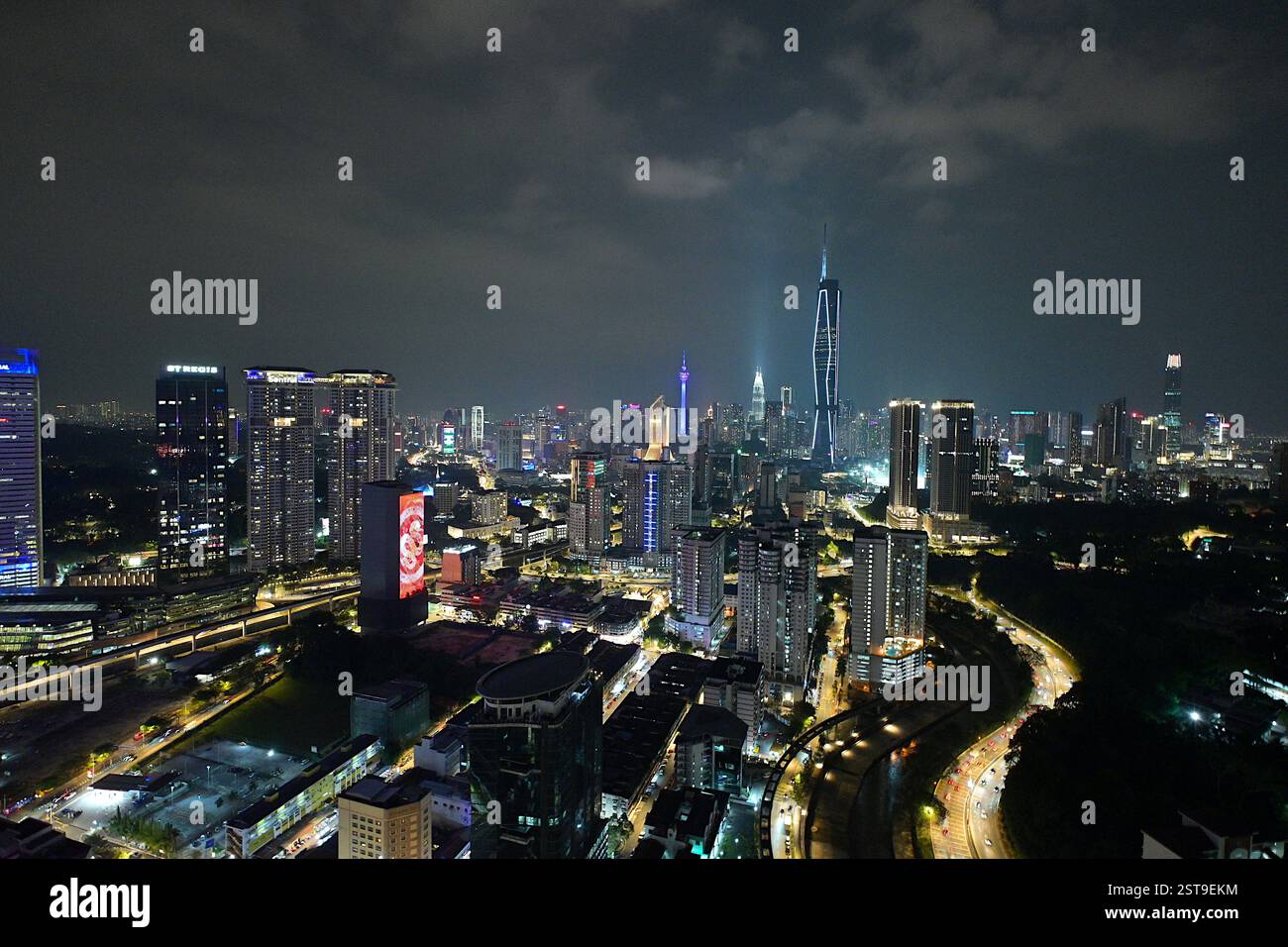 Kuala Lumpur skyline at night with KL Sentral transport & commercial ...