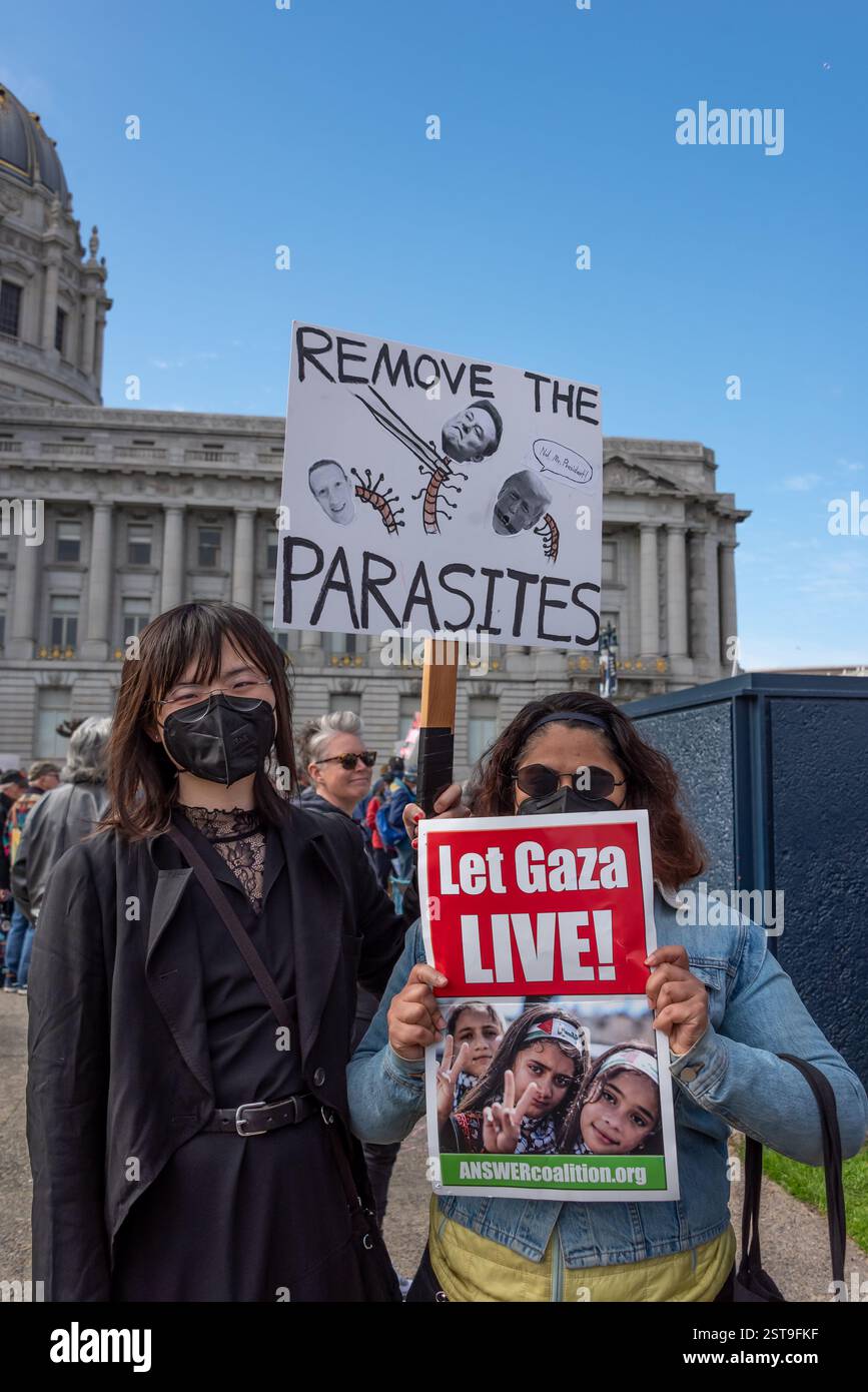 San Francisco, Calif., USA, 17th Feb, 2025. Women protesters hold signs ...