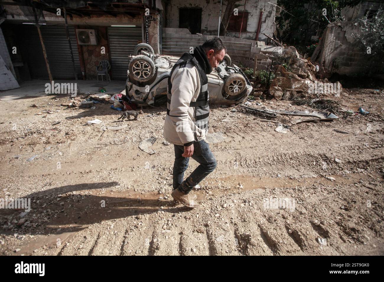 Tulkarm, Palestine. 17th Feb, 2025. A Palestinian security man inspects ...