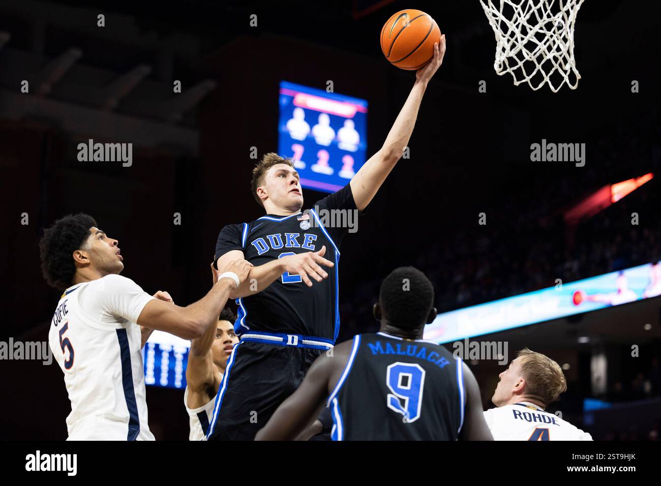 Duke guard Cooper Flagg shoots the ball past Virginia forward Jacob Cofie (5) during the first ...