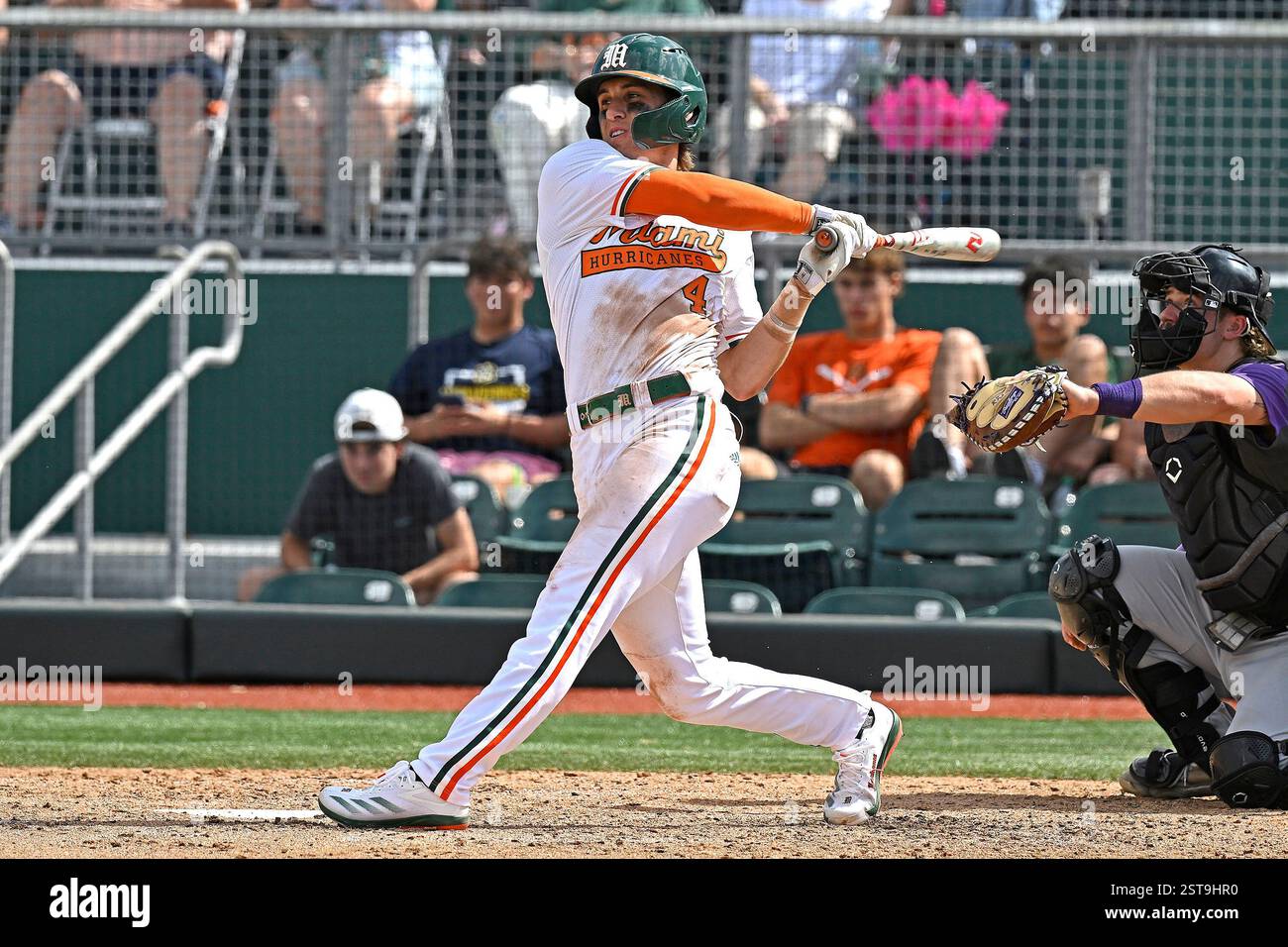 CORAL GABLES, FL - FEBRUARY 16: Miami infielder Jake Ogden (4) bats in ...