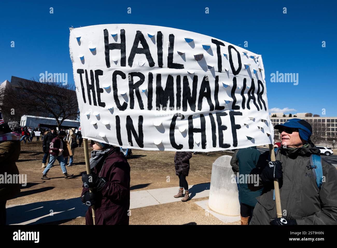 Washington, United States. 17th Feb, 2025. A protester holds a placard ...