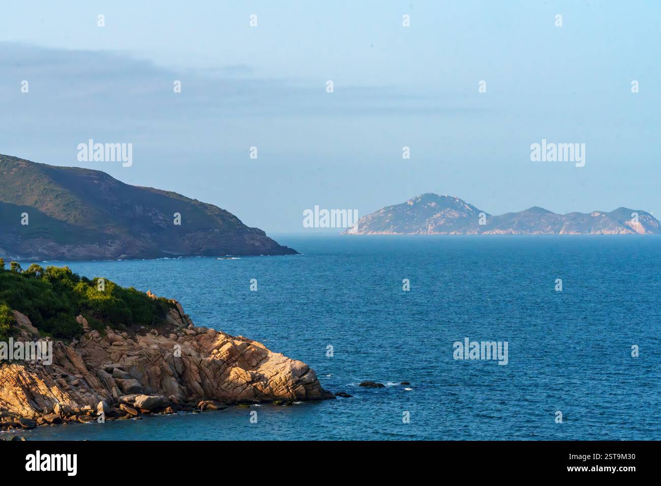 Wild view of sea, moutain and hills Stock Photo - Alamy