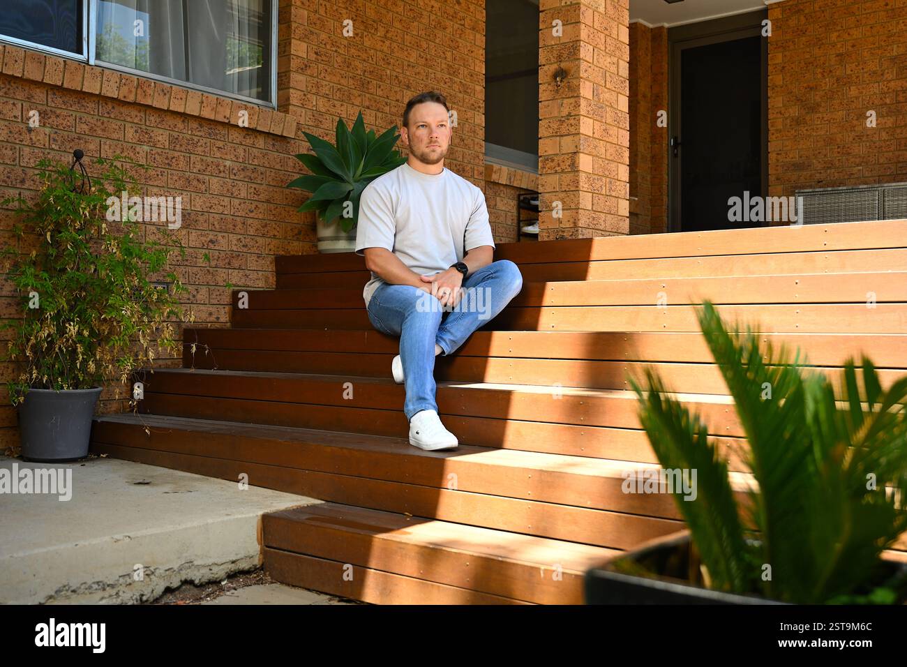 Canberra, Australia. 18th Feb, 2025. Homeowner Timon Howes poses for a ...