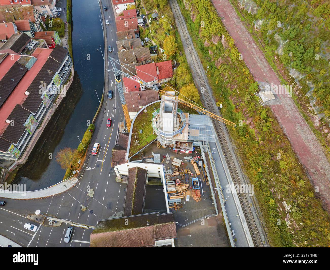Aerial view of the construction site with surrounding road and river ...