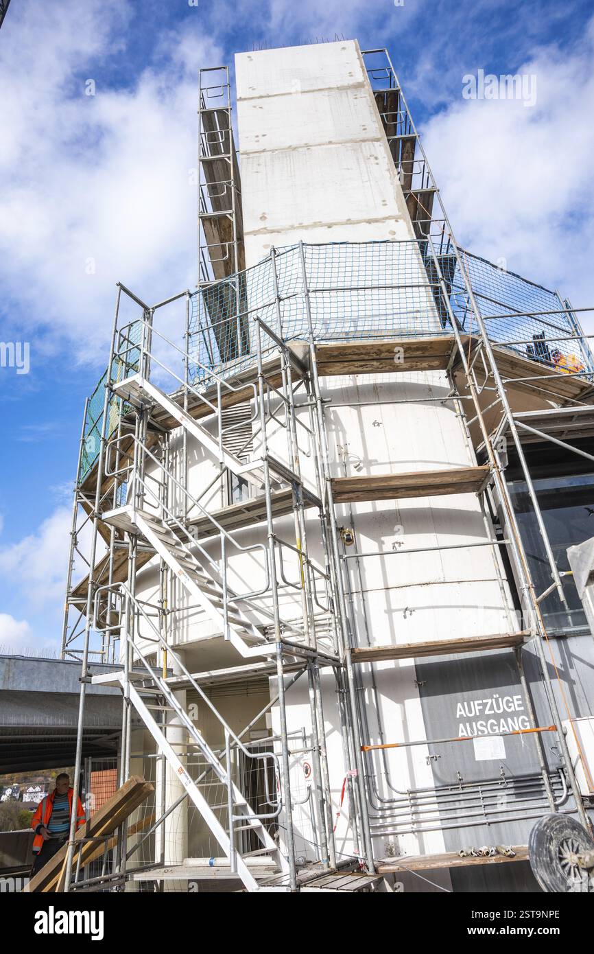 View of a high scaffolding and a staircase in front of a blue sky ...