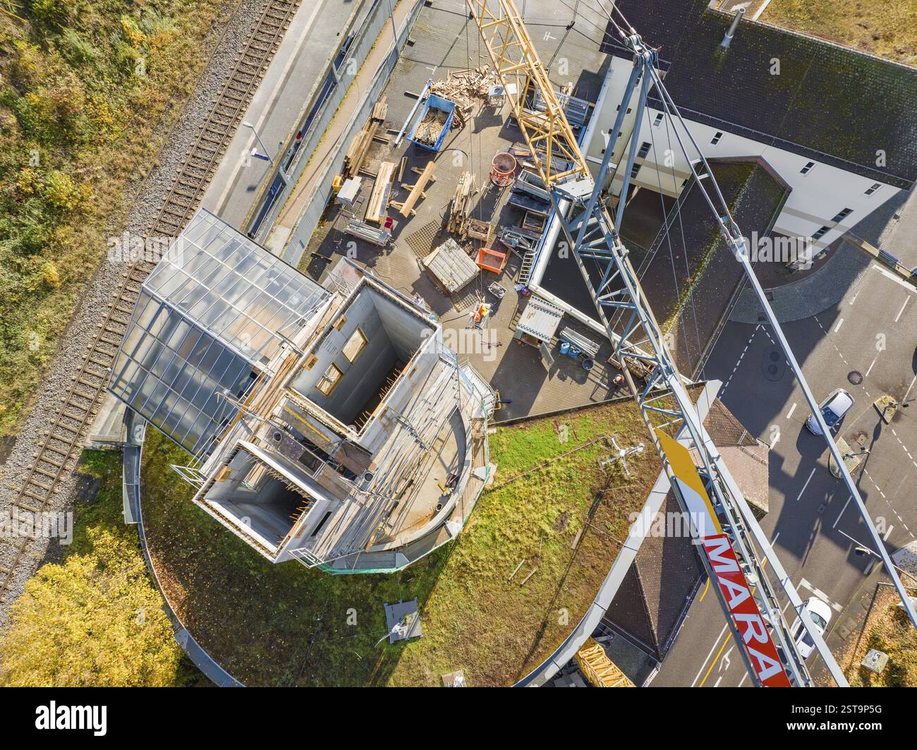 Bird's eye view of a construction site with crane and surrounding ...