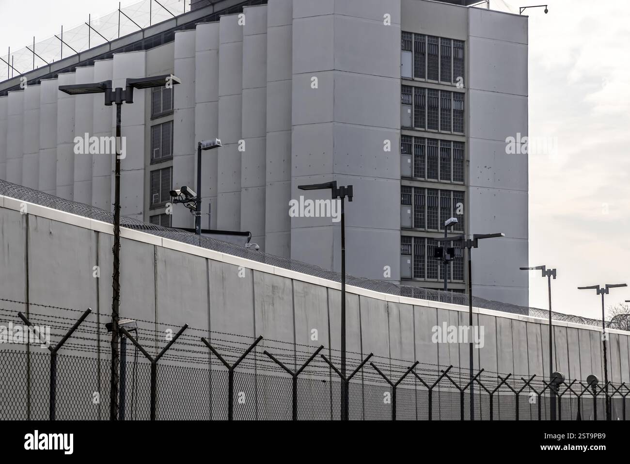 Stammheim prison, JVA. Exterior view with prison wall and barbed wire ...
