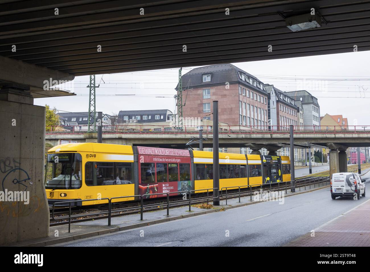 Yellow DVB tram train in the city centre of Dresden. Loebtauer Strasse ...