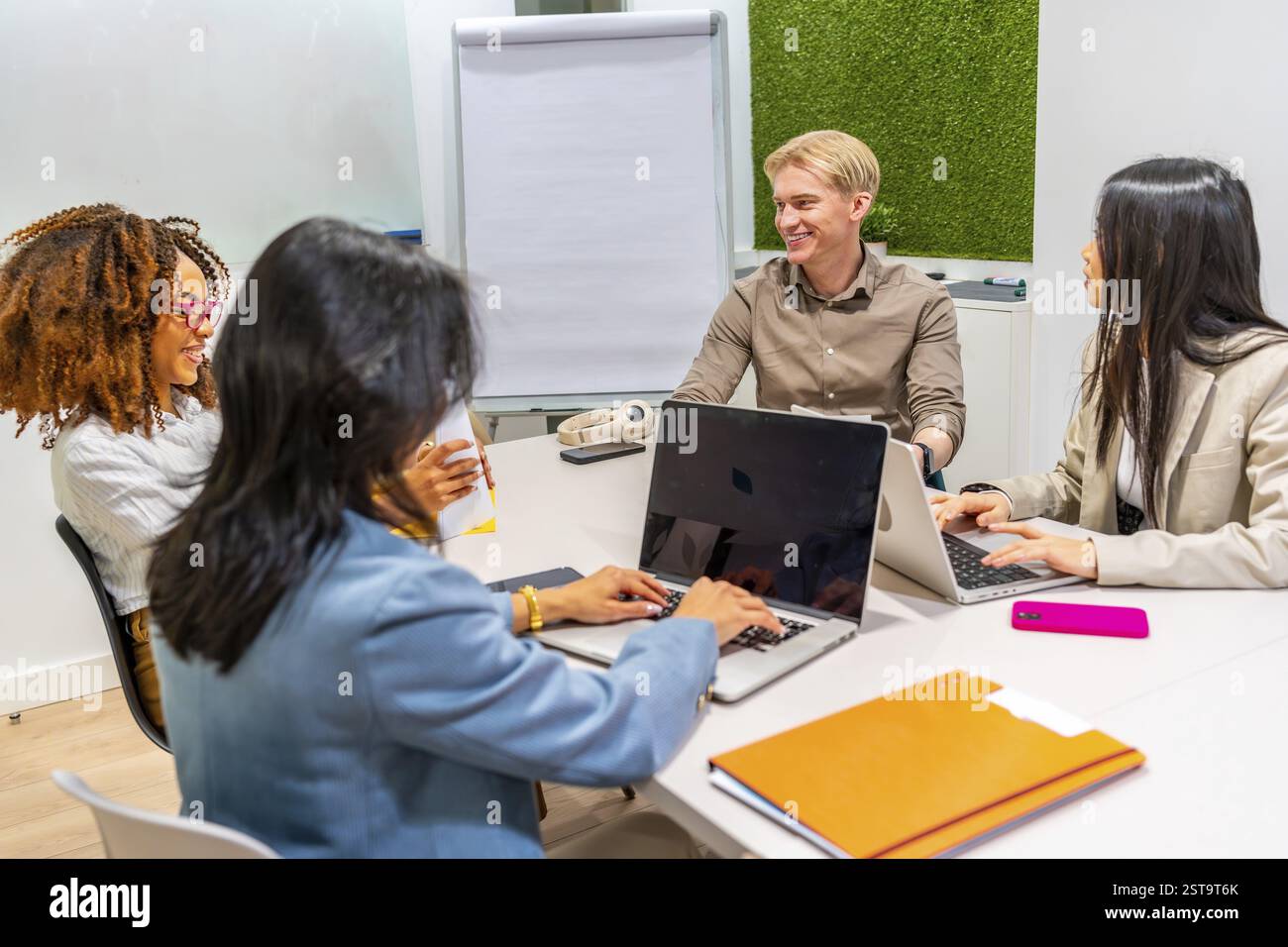 Collaborating on whiteboard team discussing hi-res stock photography ...