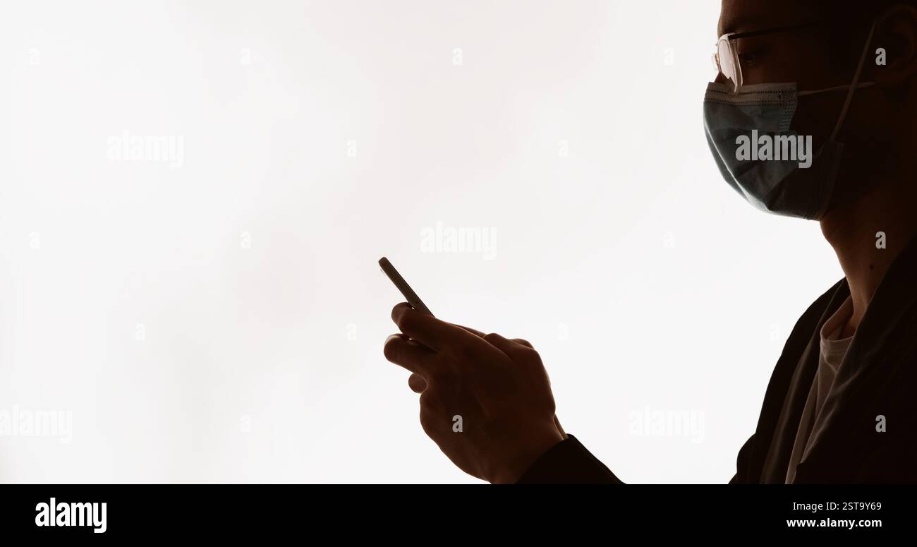 Quarantine chat. Distant communication. Dark profile silhouette of man ...