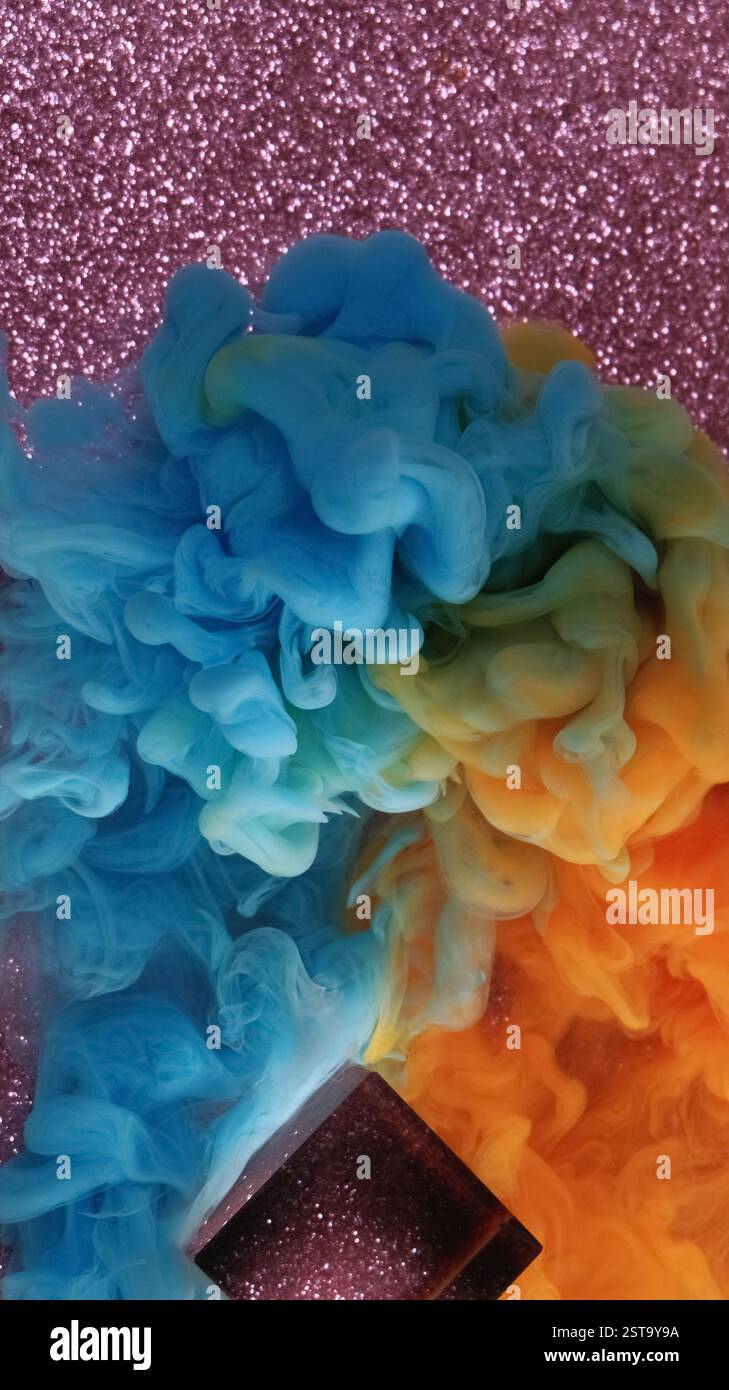 Multicolored smoke. Paint explode. Blue orange blur stream haze spreads ...