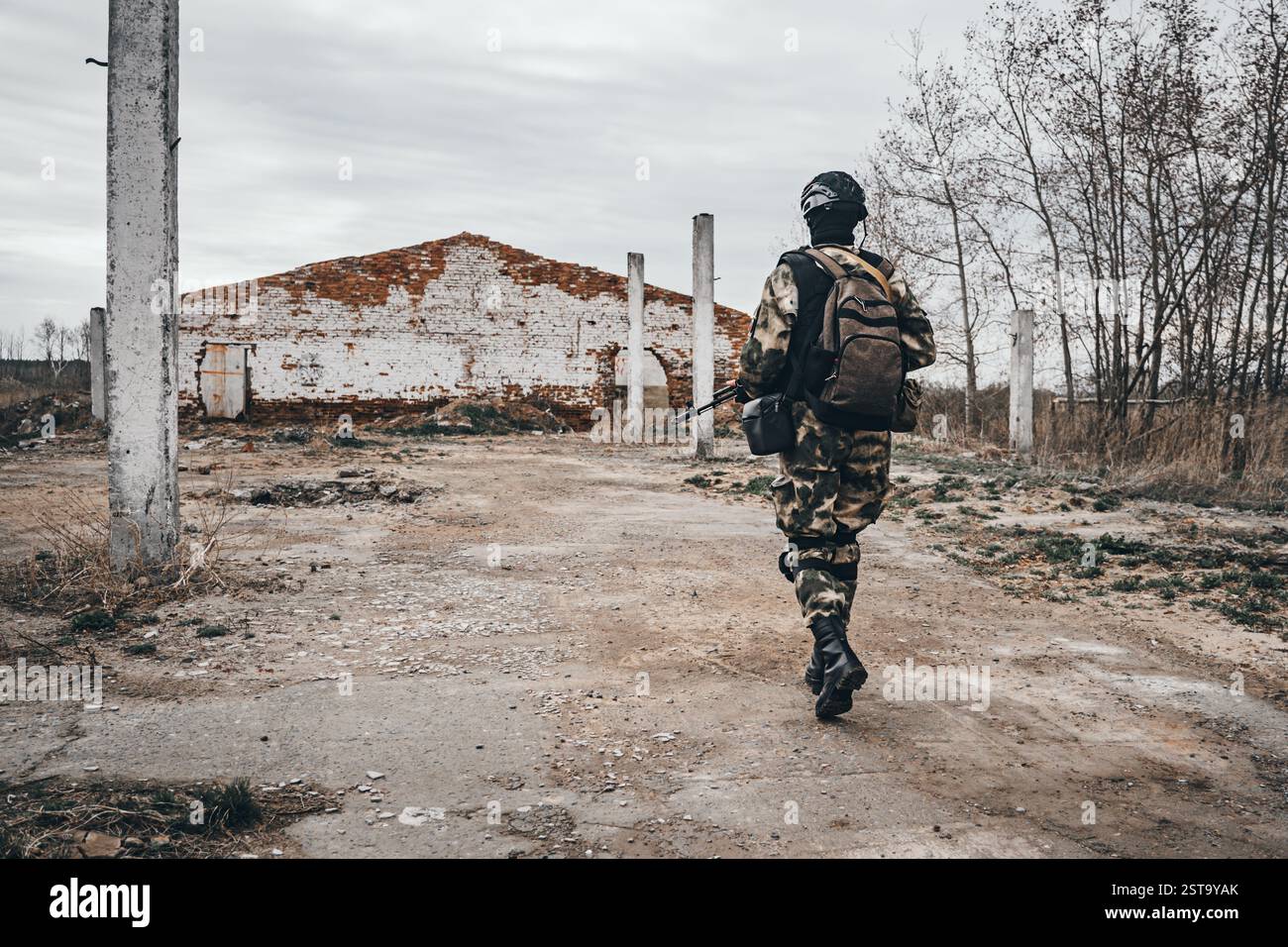 Photo of a fully equipped soldier in armored vest, helmet, face glasses ...