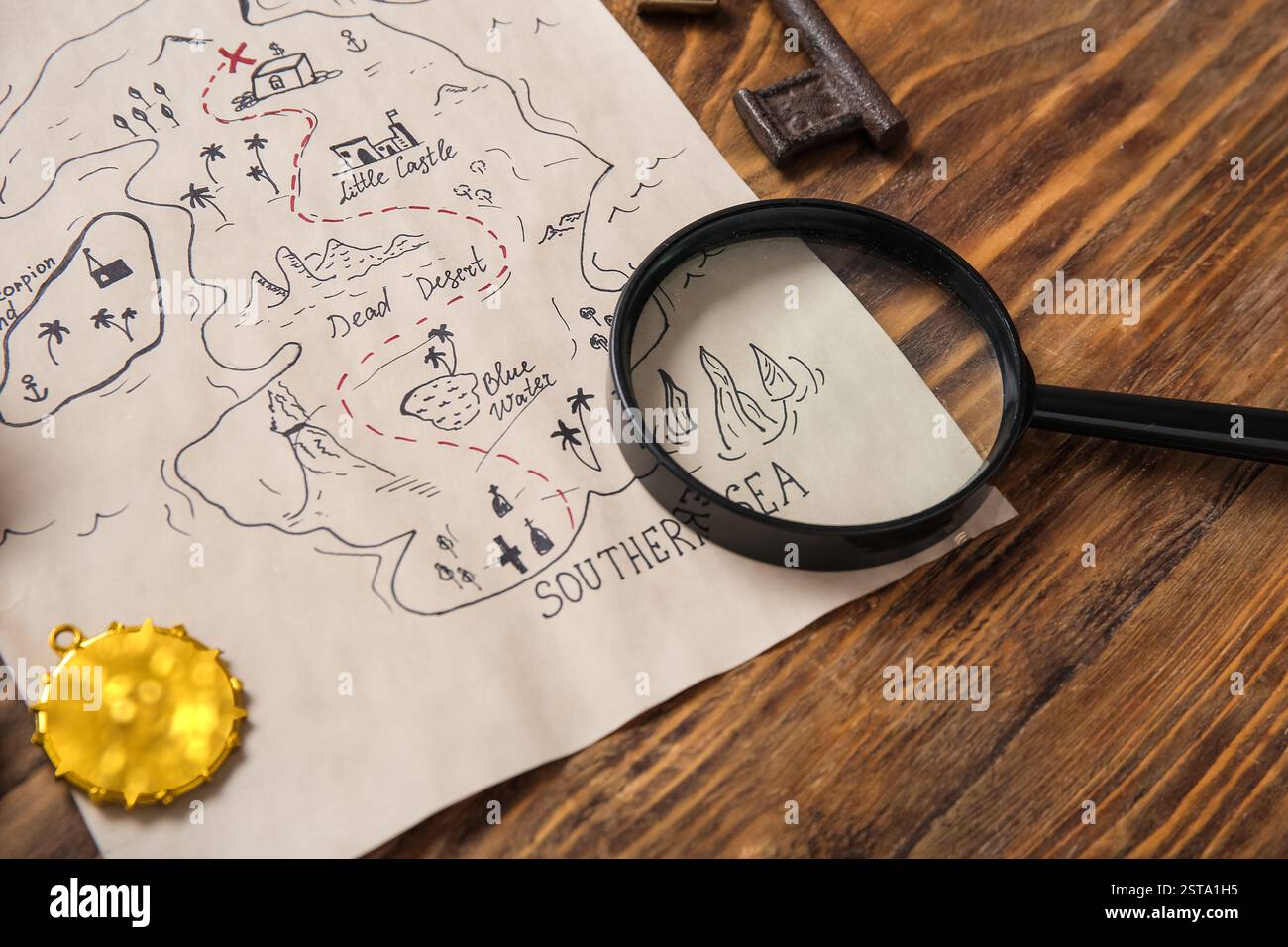 Magnifier on treasure map hi-res stock photography and images - Alamy