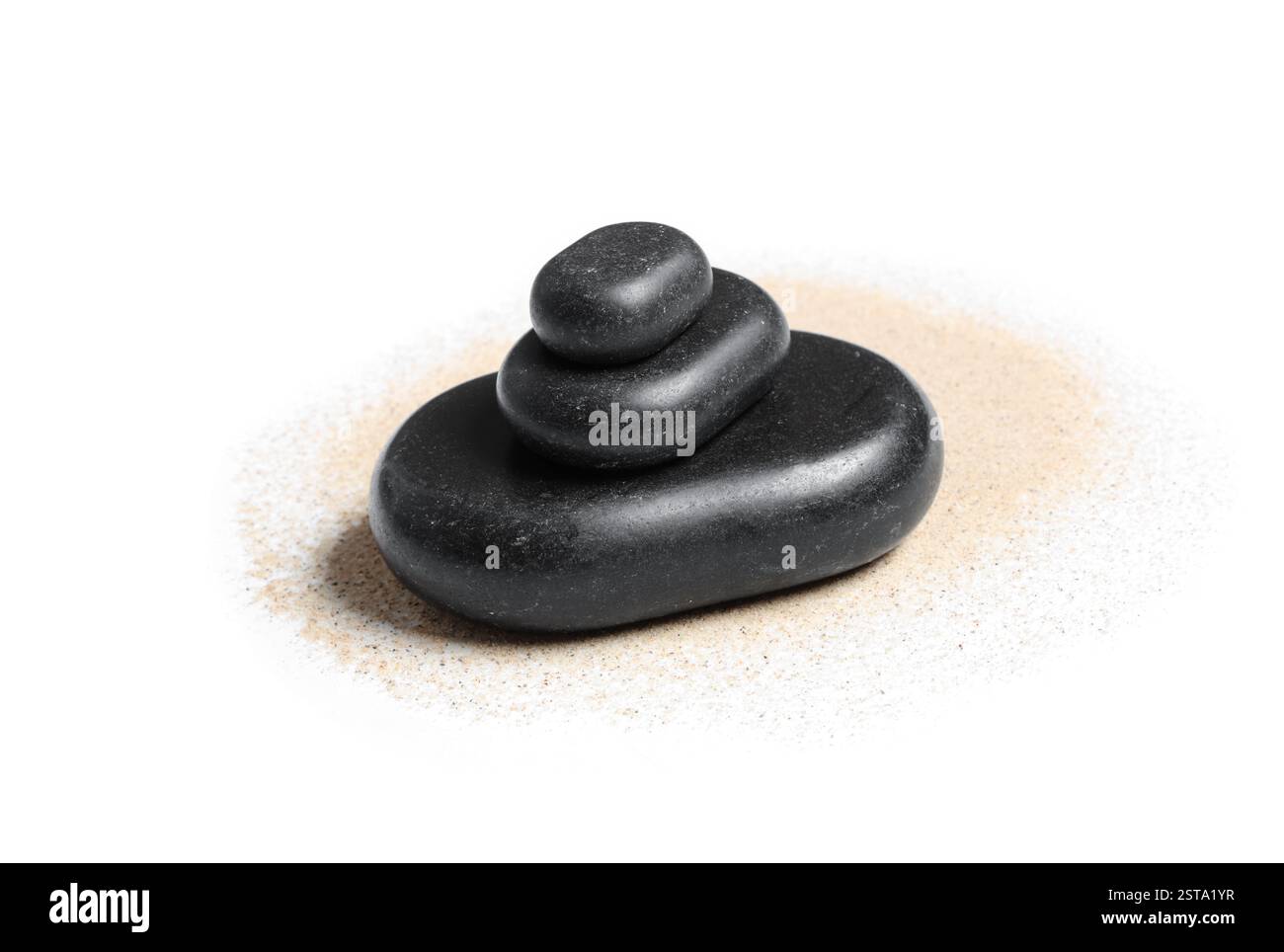 Light beach sand with black pebbles on white background Stock Photo - Alamy