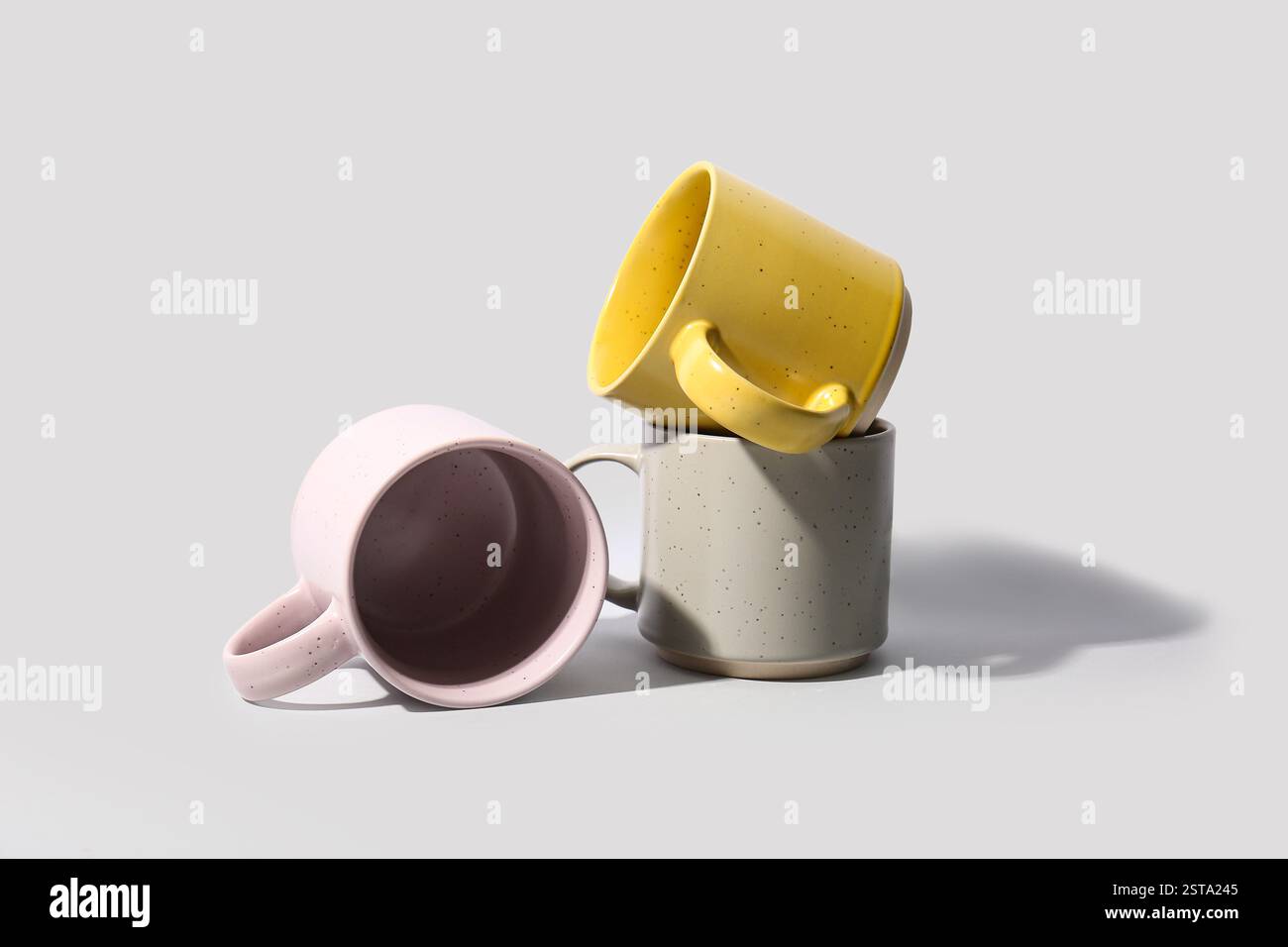 Different ceramic mugs on white background Stock Photo - Alamy