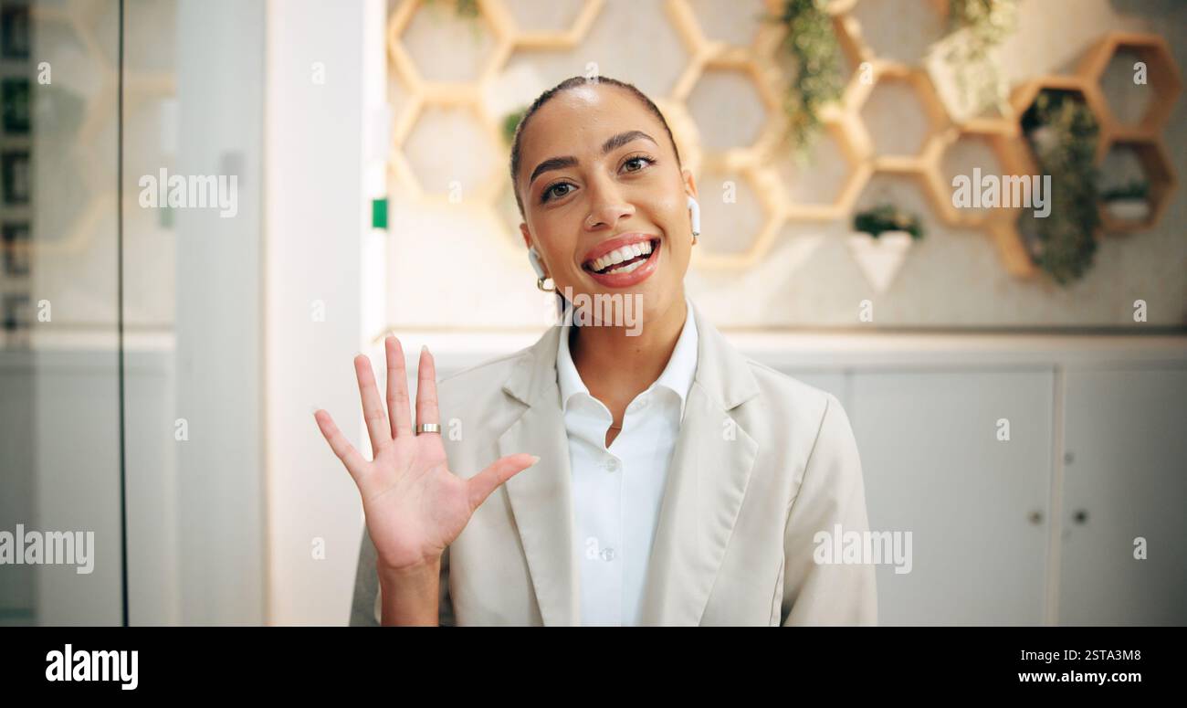 Portrait, video call and wave with woman in hotel for introduction ...