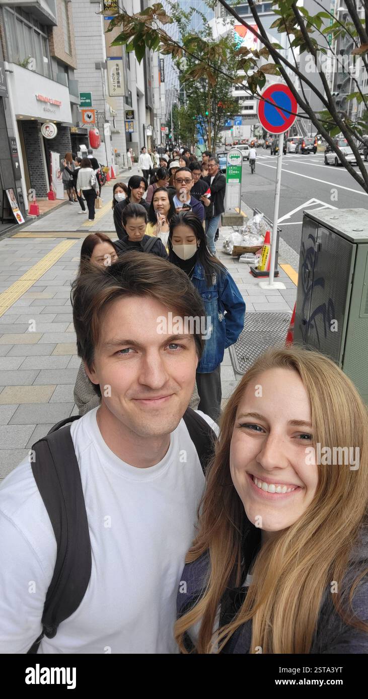 Tokyo , Japan - Dec 27 2024:people line up for popular food in Japan ...