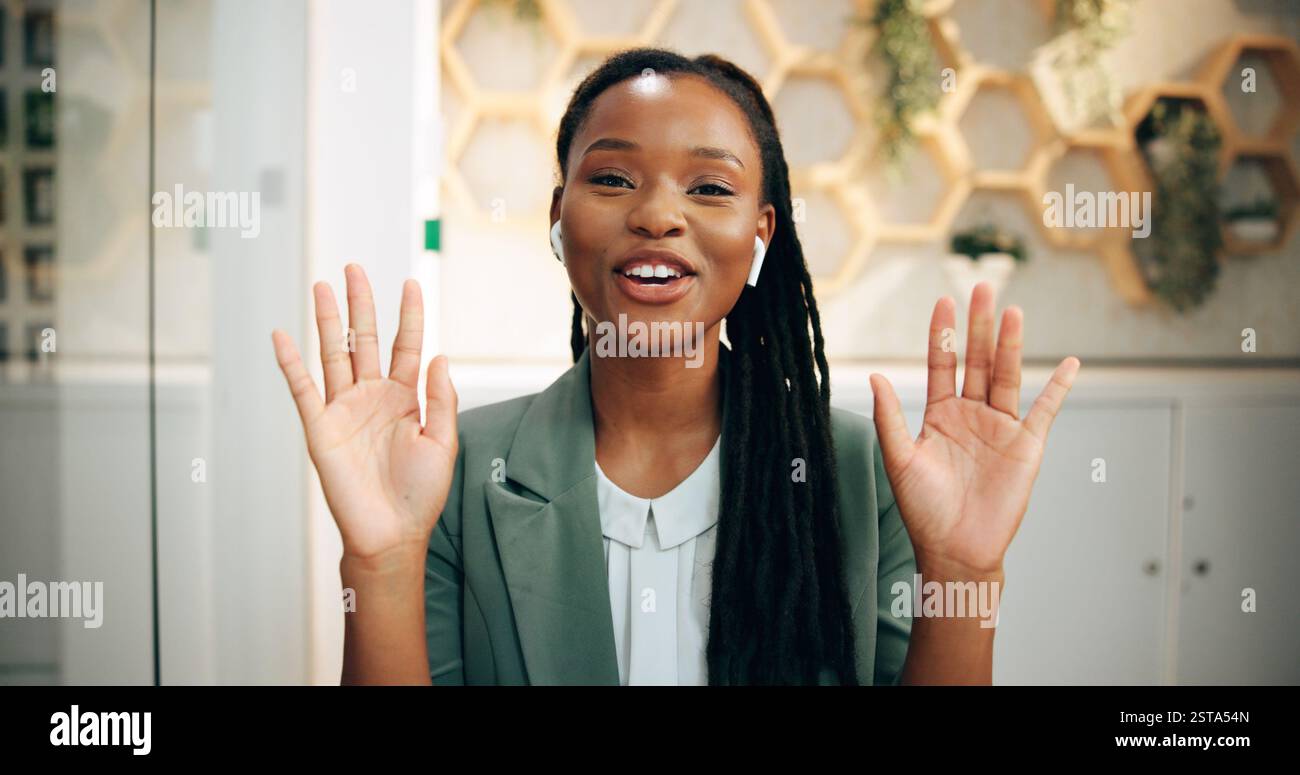 Portrait, video call and wave with black woman in hotel for ...