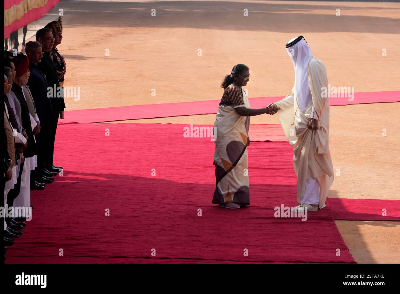 Indian President Droupadi Murmu welcomes Qatar's Emir Sheikh Tamim bin Hamad Al-Thani, during ...
