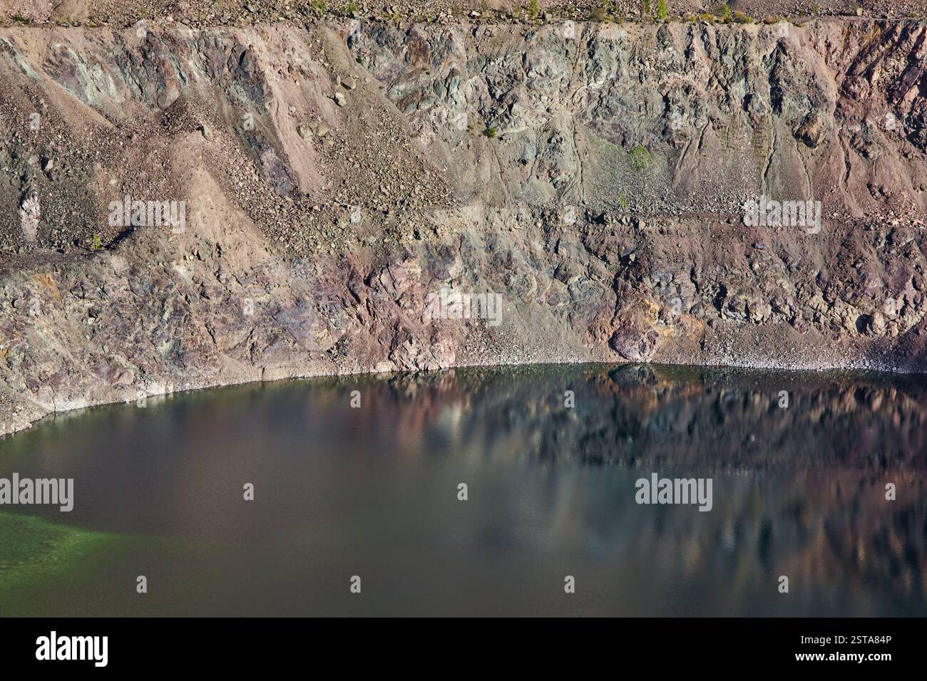 Old open mining pit in mountain. Open-pit quarry, mine landscape, pond ...