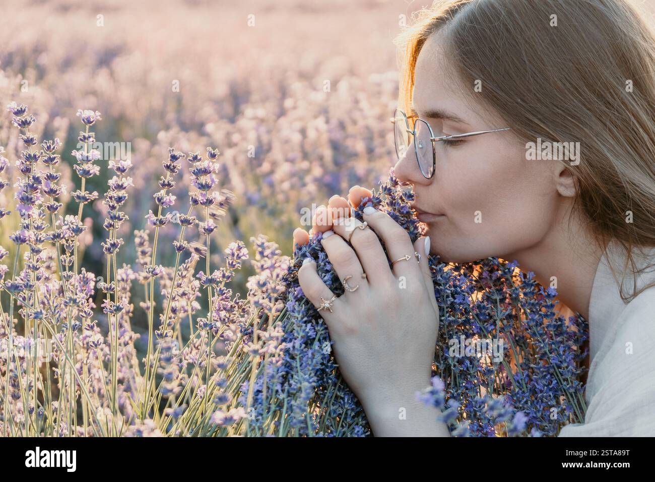 Beautiful woman sniffing bouquet hi-res stock photography and images ...
