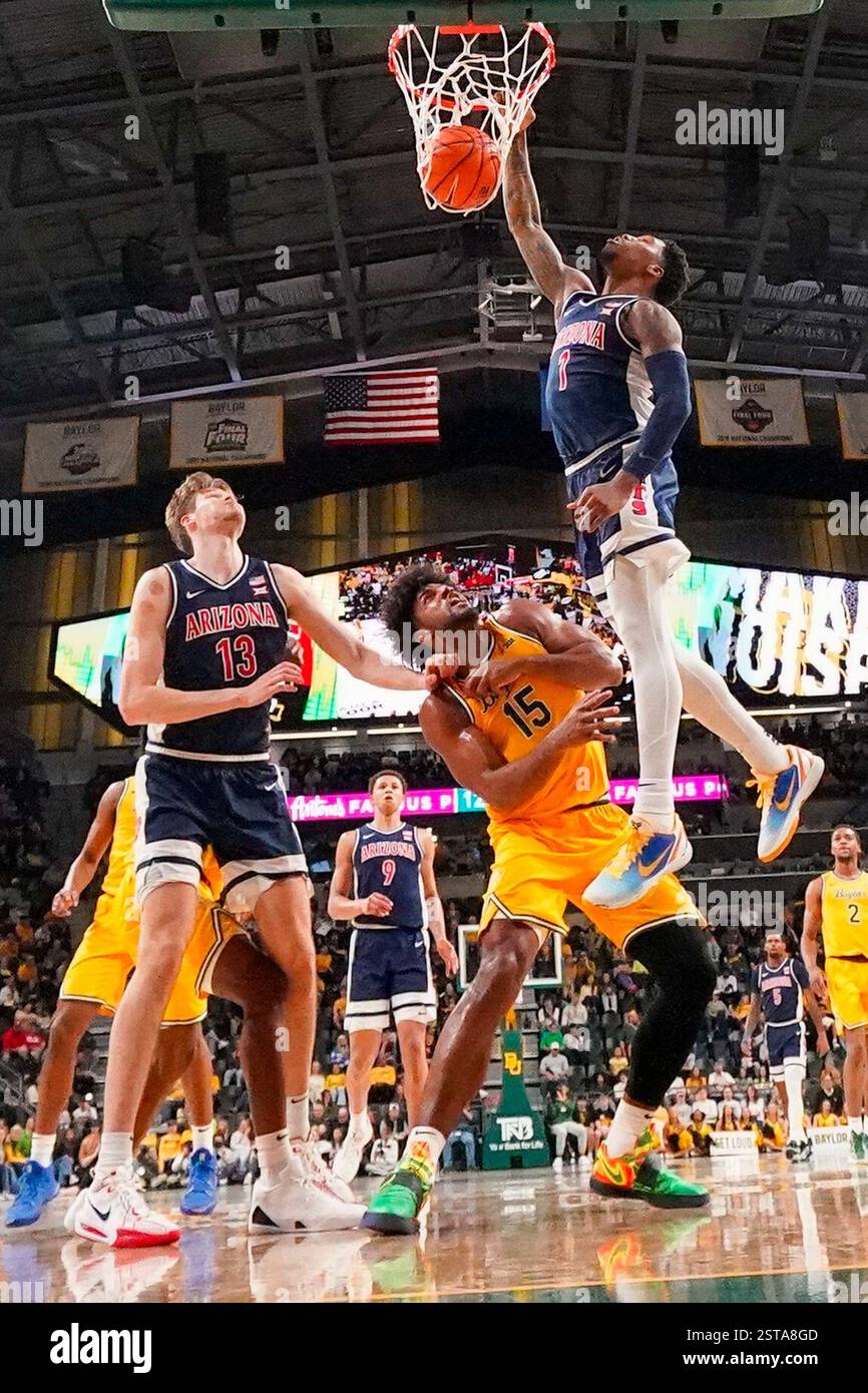 Arizona guard Caleb Love (1) dunks on Baylor forward Norchad Omier (15 ...