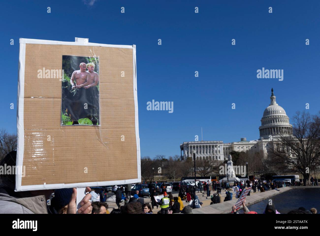 A protester holds a sign during the rally against the Donald Trump ...