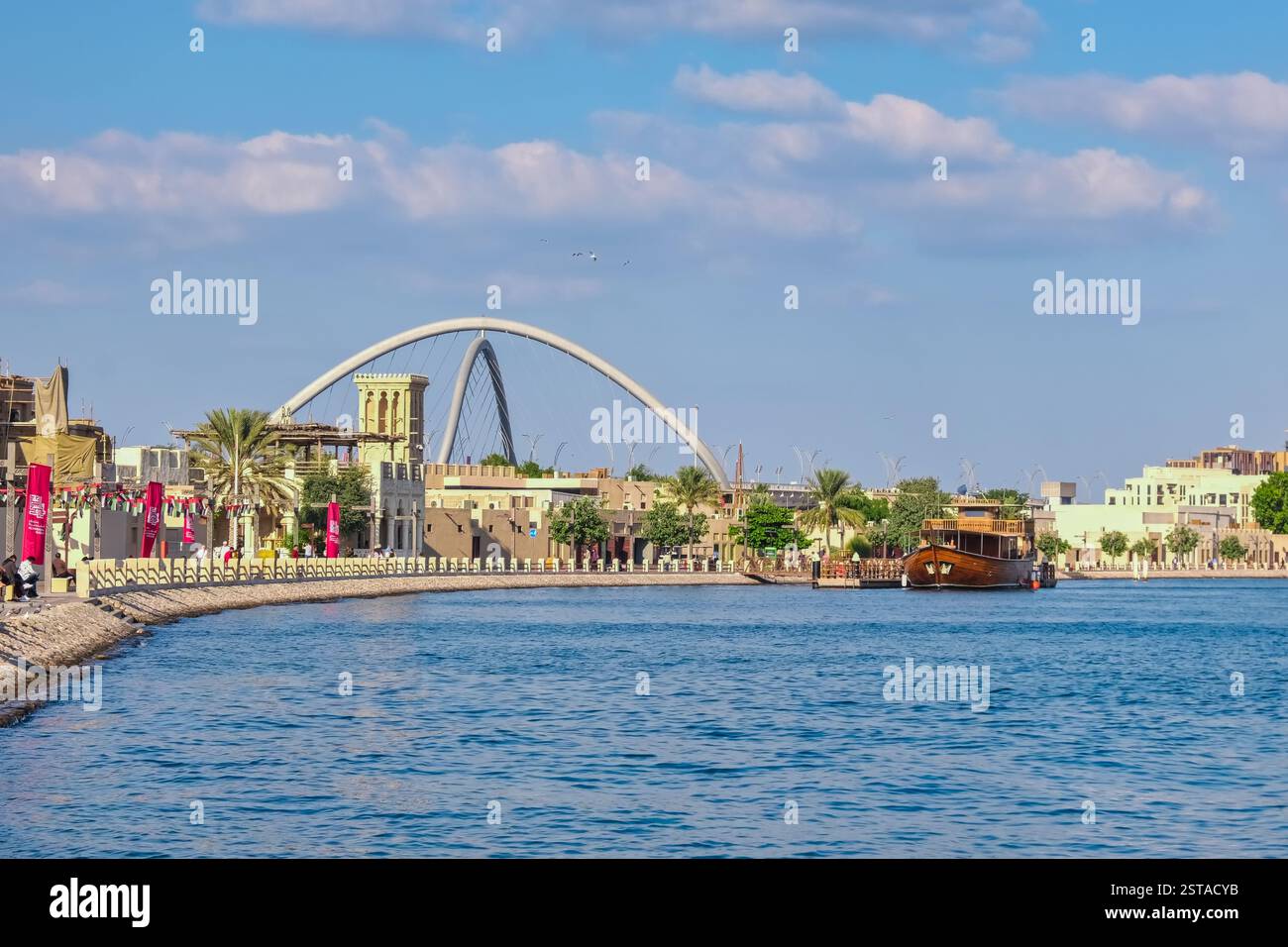Modern iconic Infinity bridge across the Creek channel in the Al ...