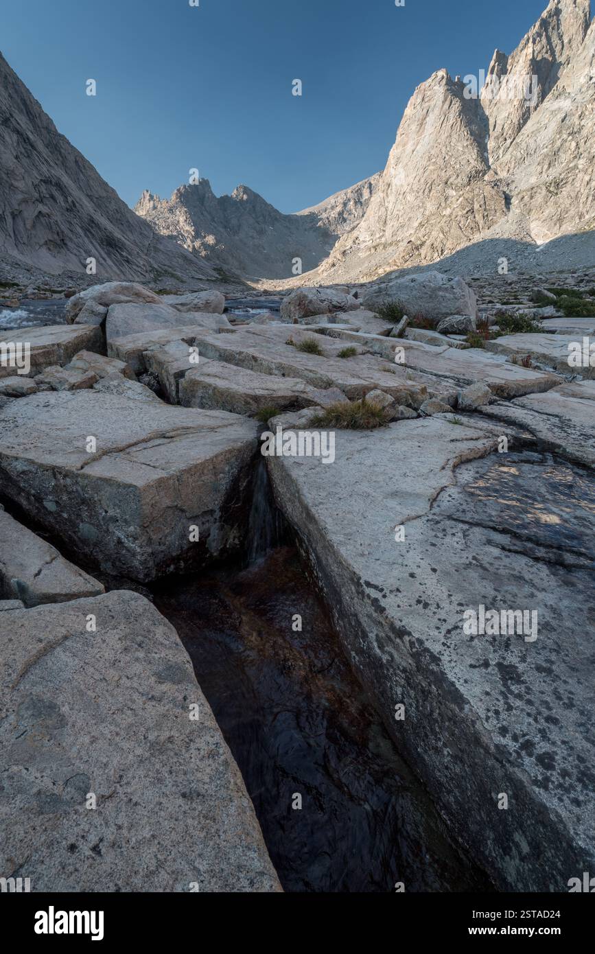 Stream flowing through cracks in bedrock, Wind River Range, Wyoming ...