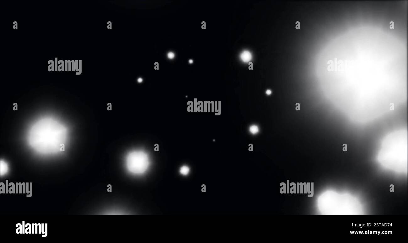 Image of glowing light spots moving over black background Stock Photo ...
