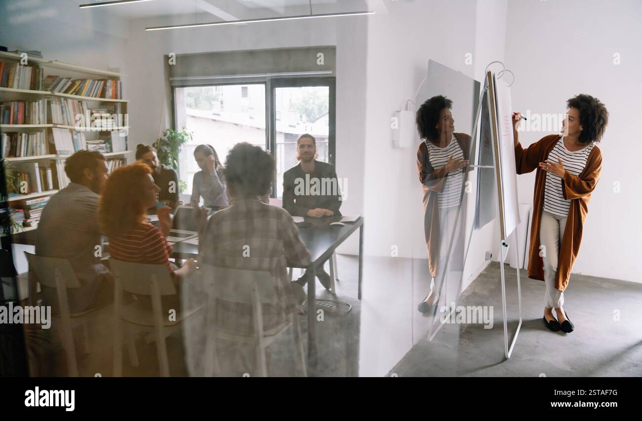 Multiracial business coworkers have fun cooperating together at office ...