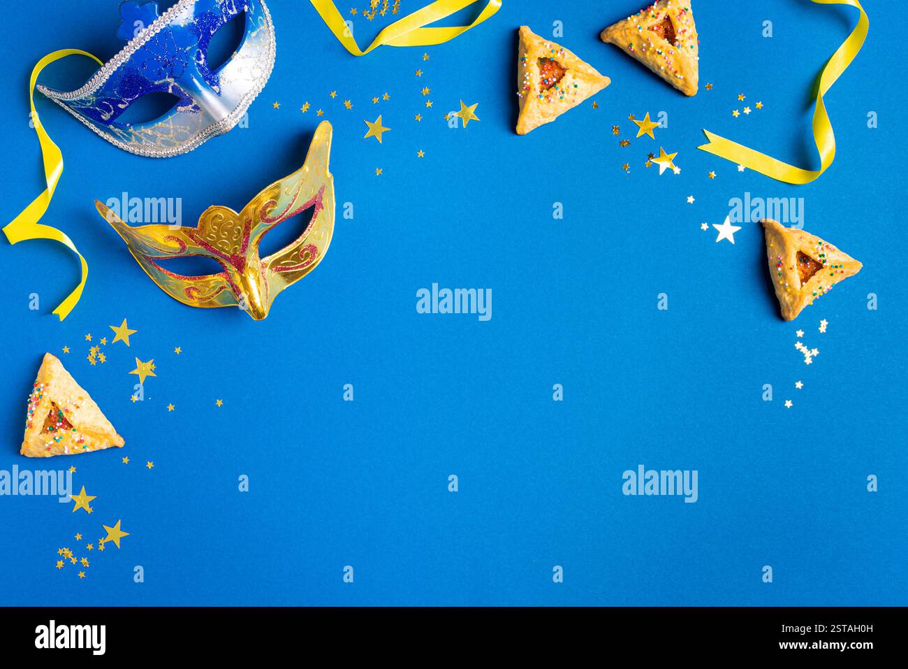 Purim celebration concept (jewish carnival holiday) on blue background ...