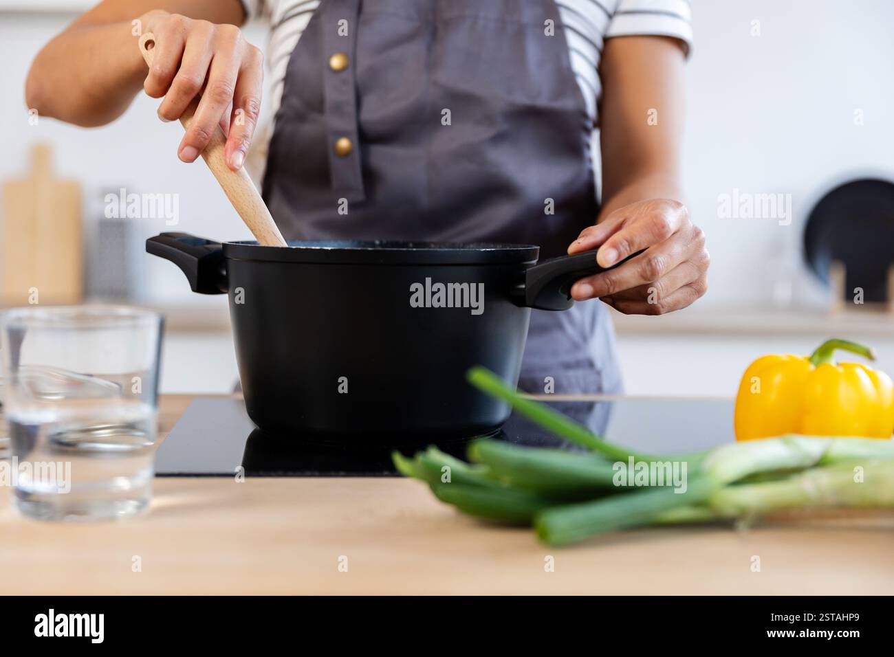 Chef cooking soup on stove hi-res stock photography and images - Alamy