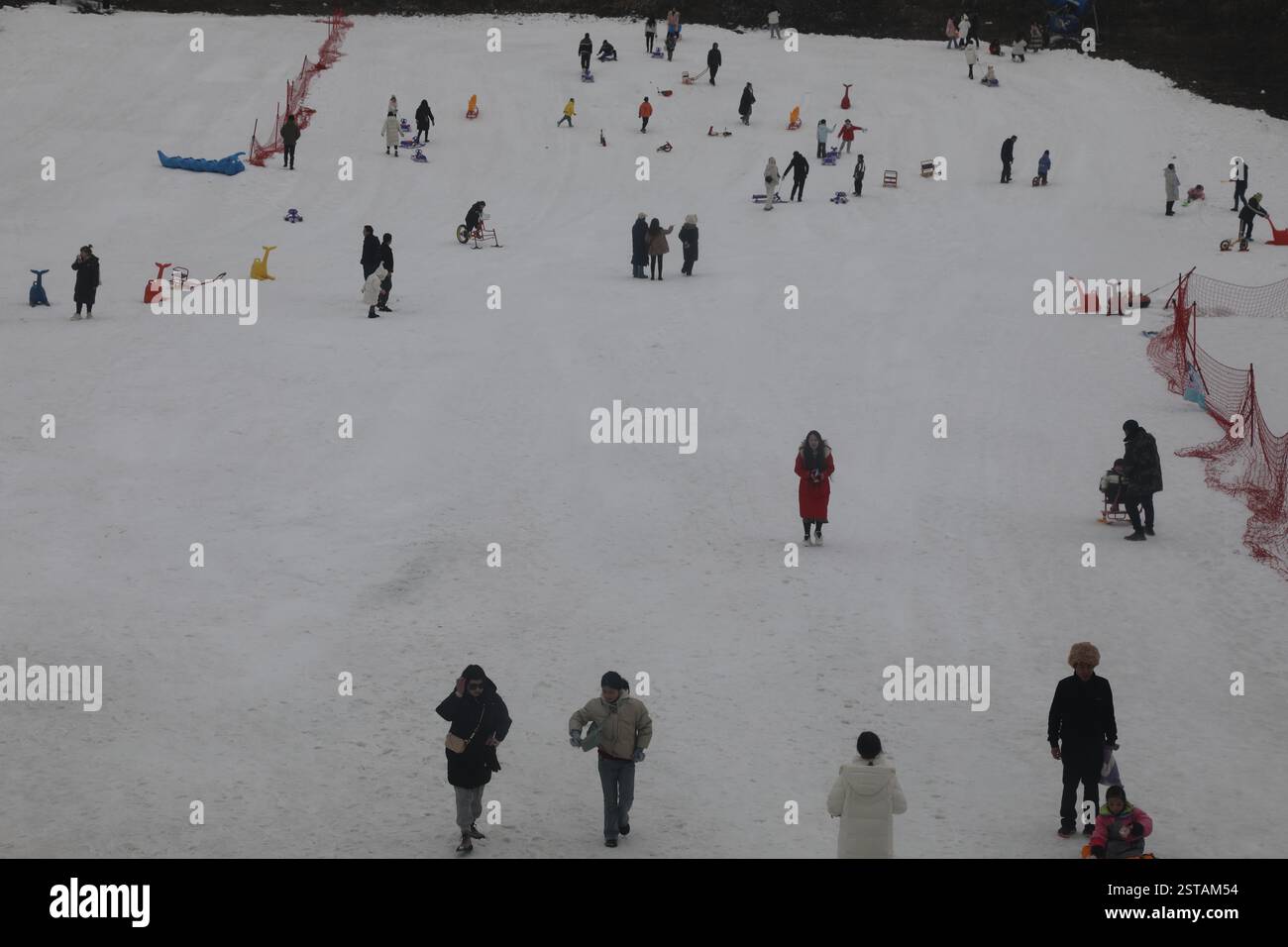 Tourists enjoy snow fun at a ski resort in Chongqing, China, 15 ...