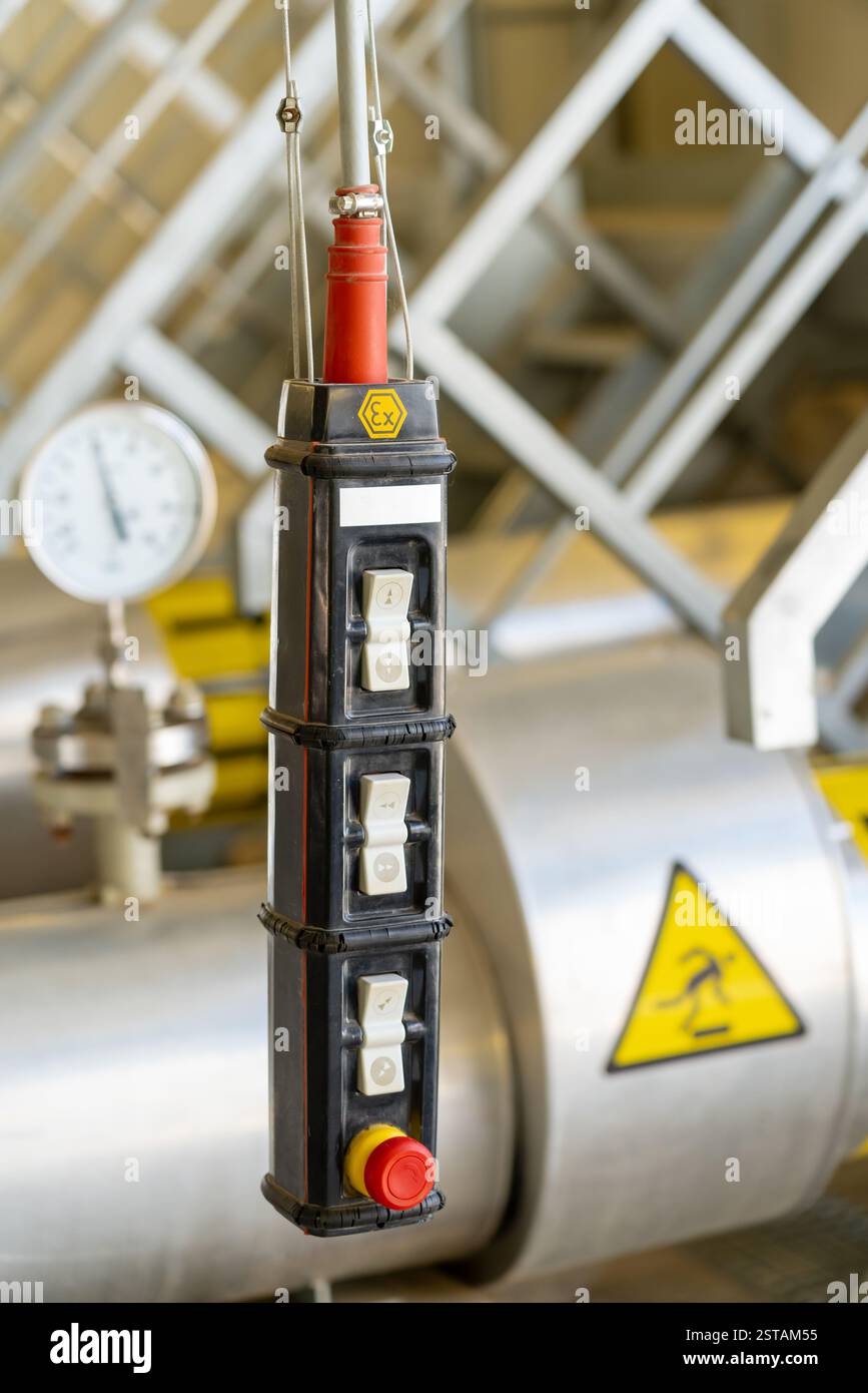 Hanging hoist crane control panel with emergency stop button in an ...