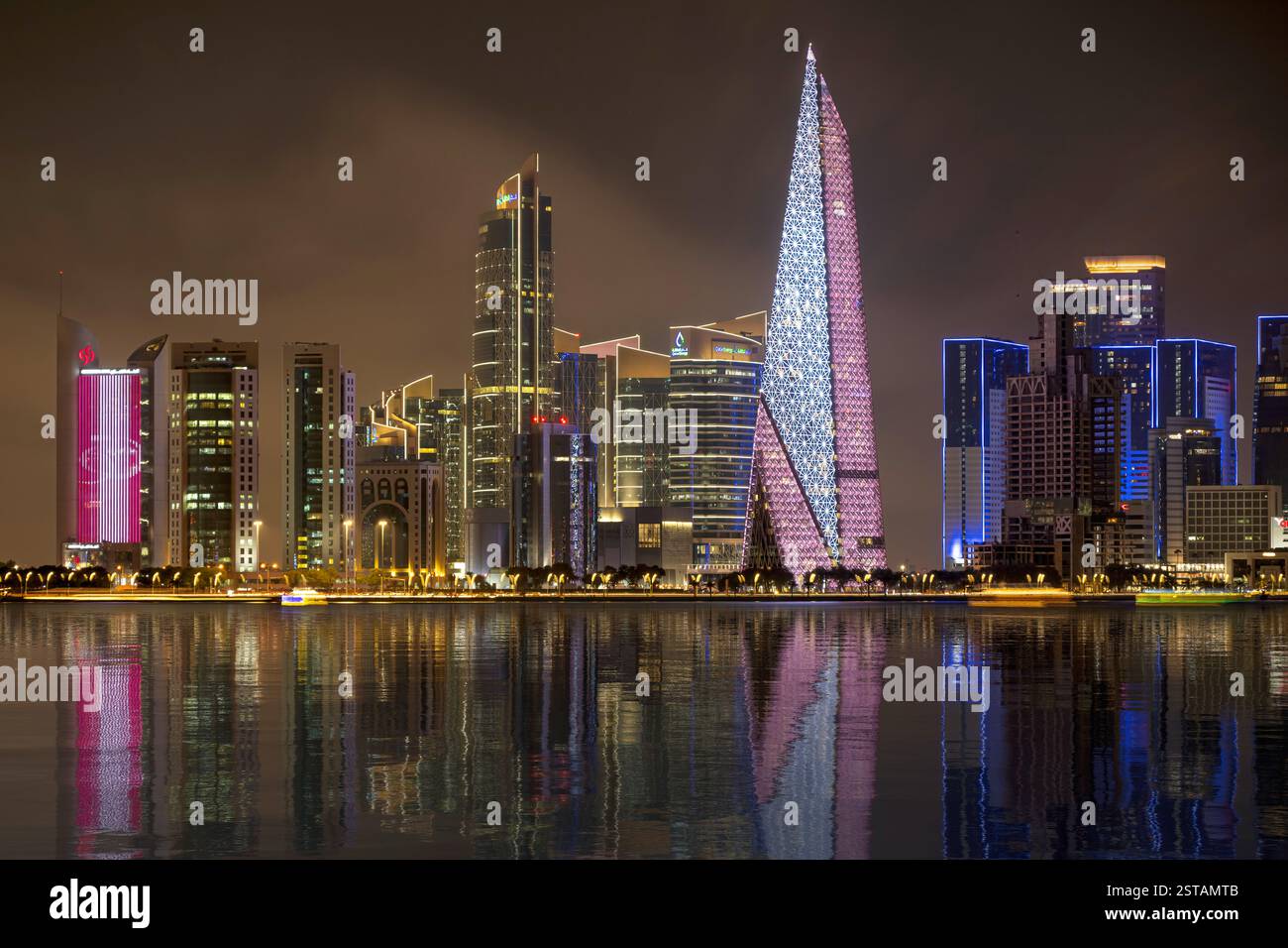 The Panoramic skyline of Doha, Qatar after sunset Stock Photo - Alamy