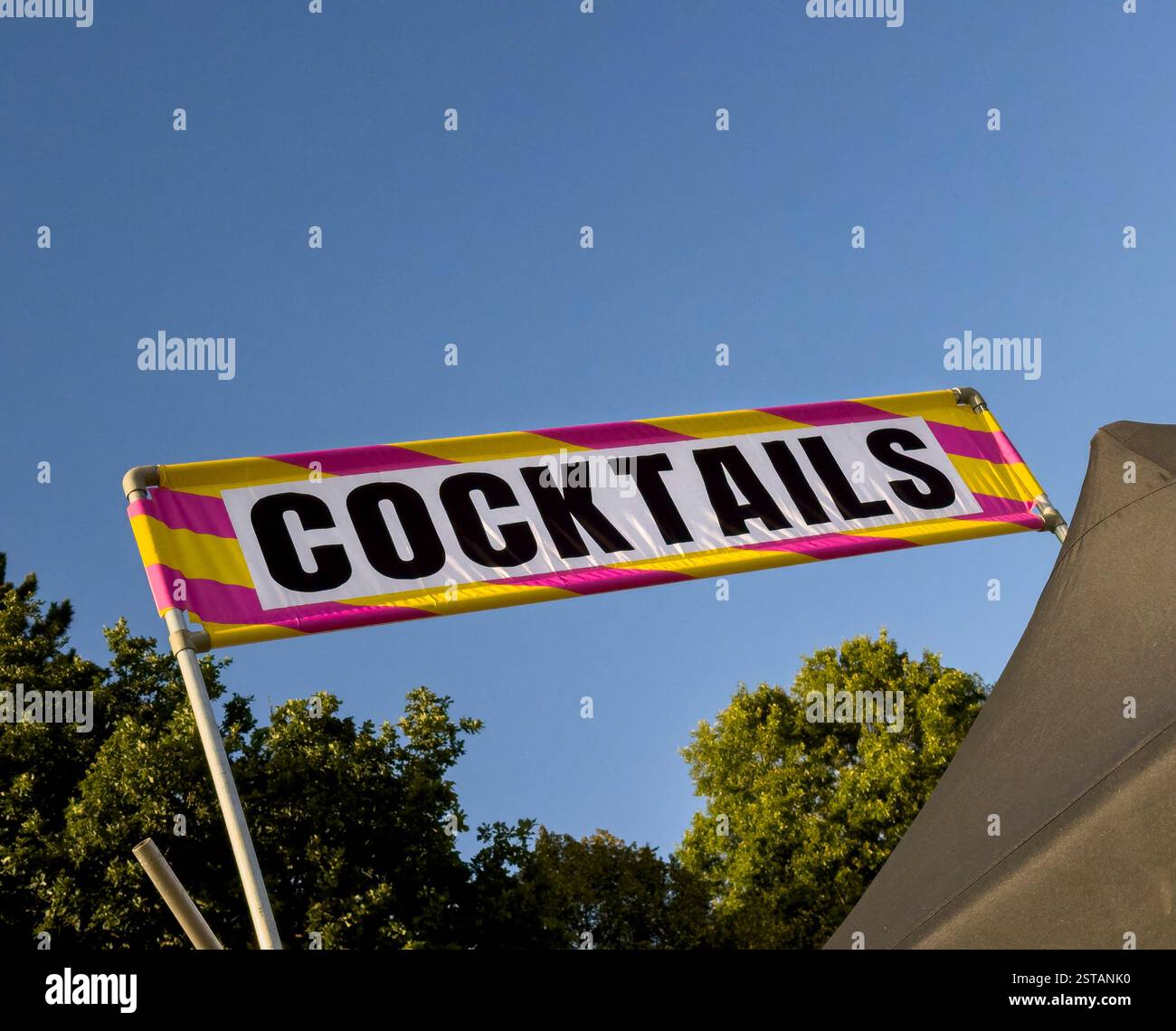 Angled shot of a cocktail stall sign against a clear blue sky Stock ...