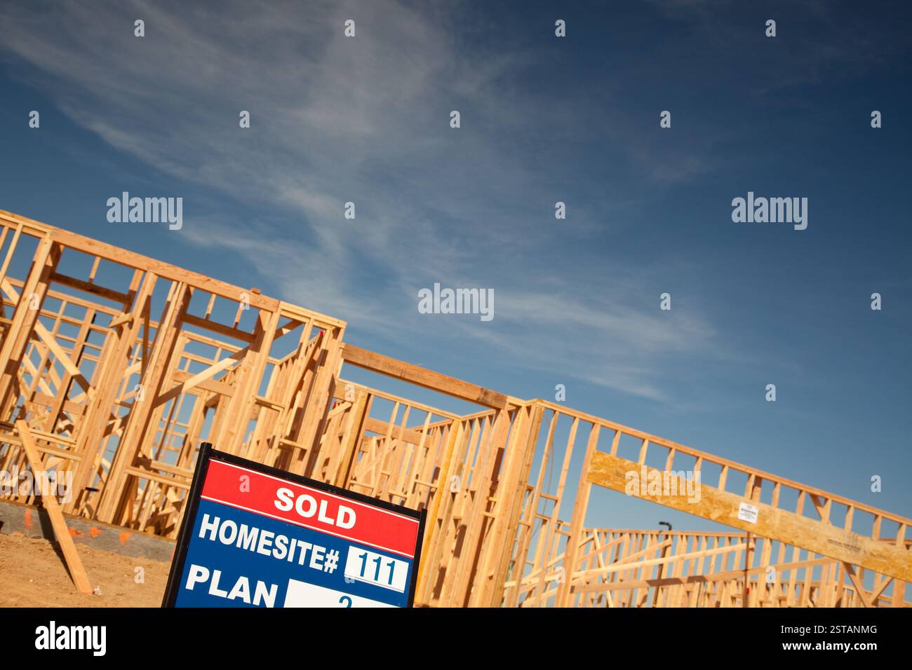 Sold Lot Real Estate Sign at New Home Framing Construction Site Against ...