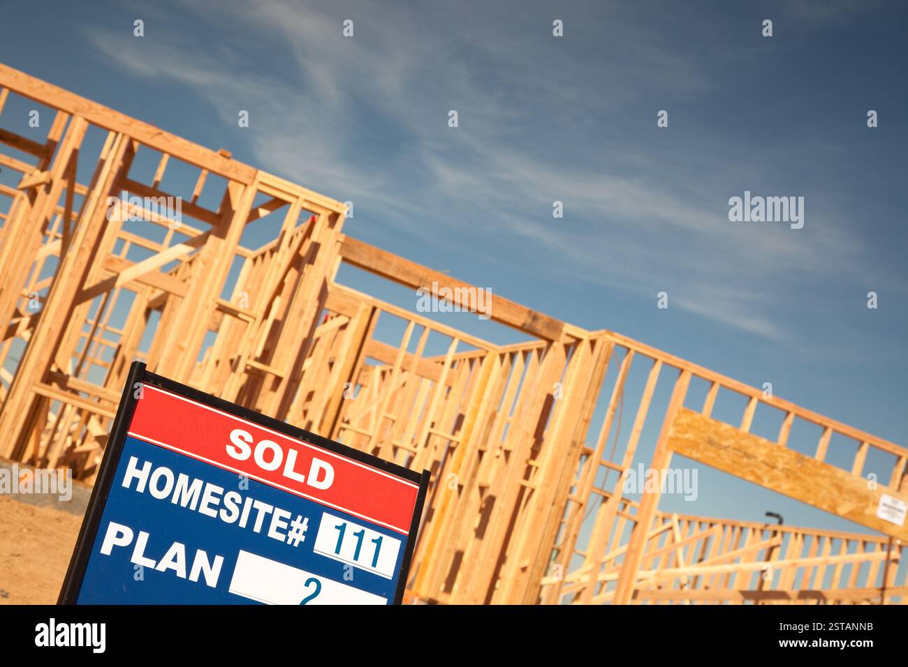 Sold Lot Real Estate Sign at New Home Framing Construction Site Against ...