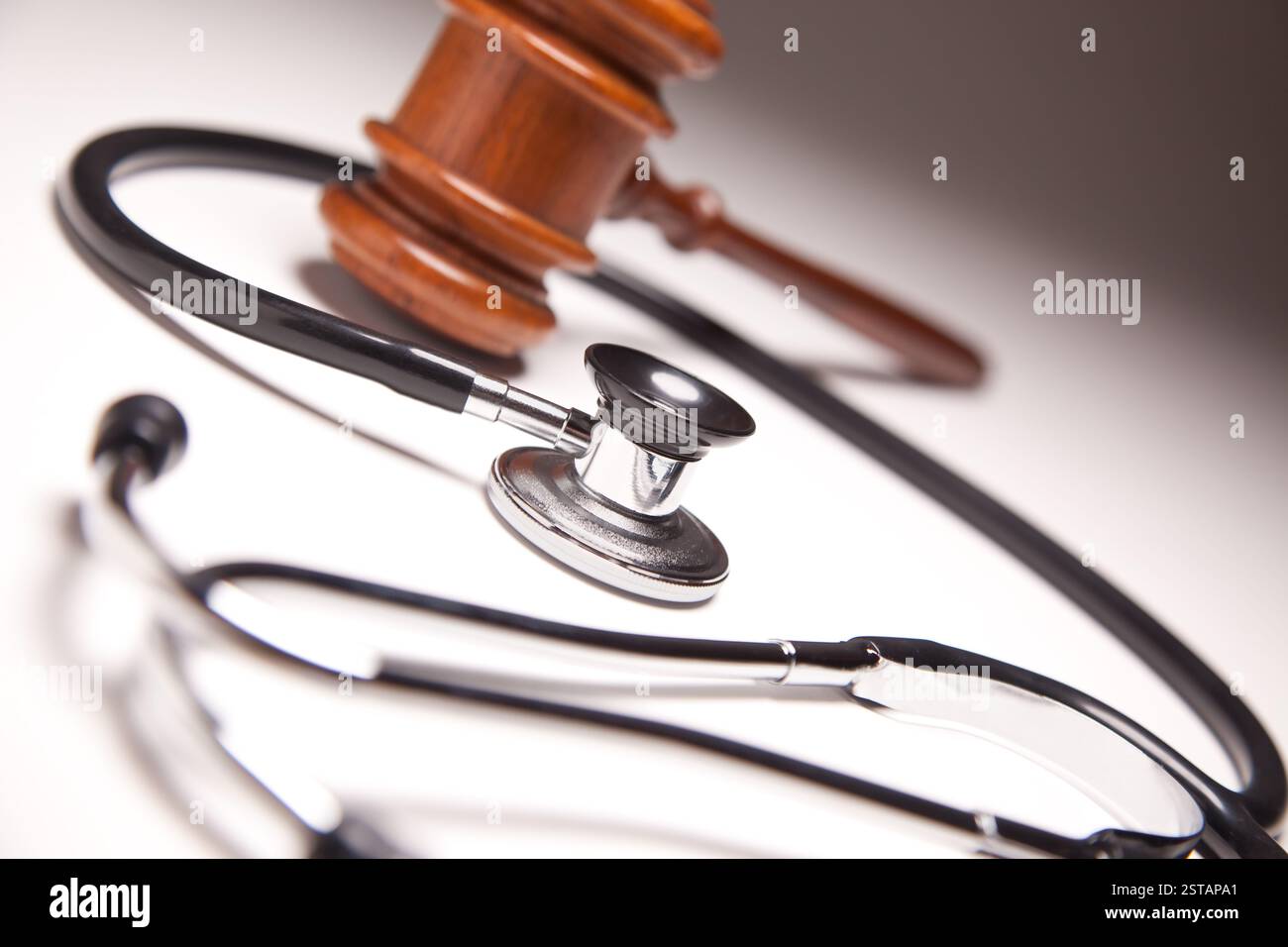 Gavel and Stethoscope on Gradated Background with Selective Focus Stock ...